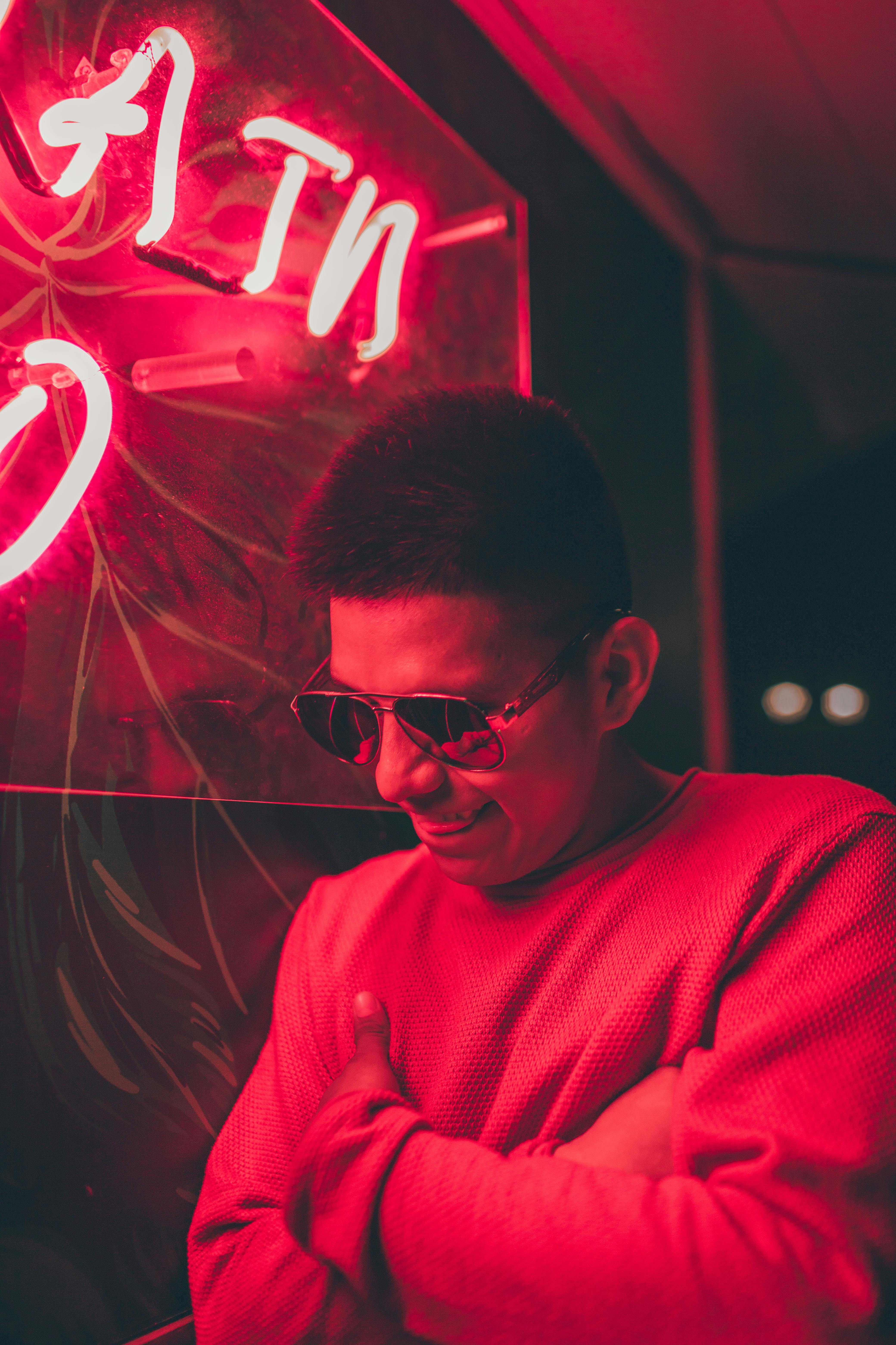 Man Near Neon Sign · Free Stock Photo