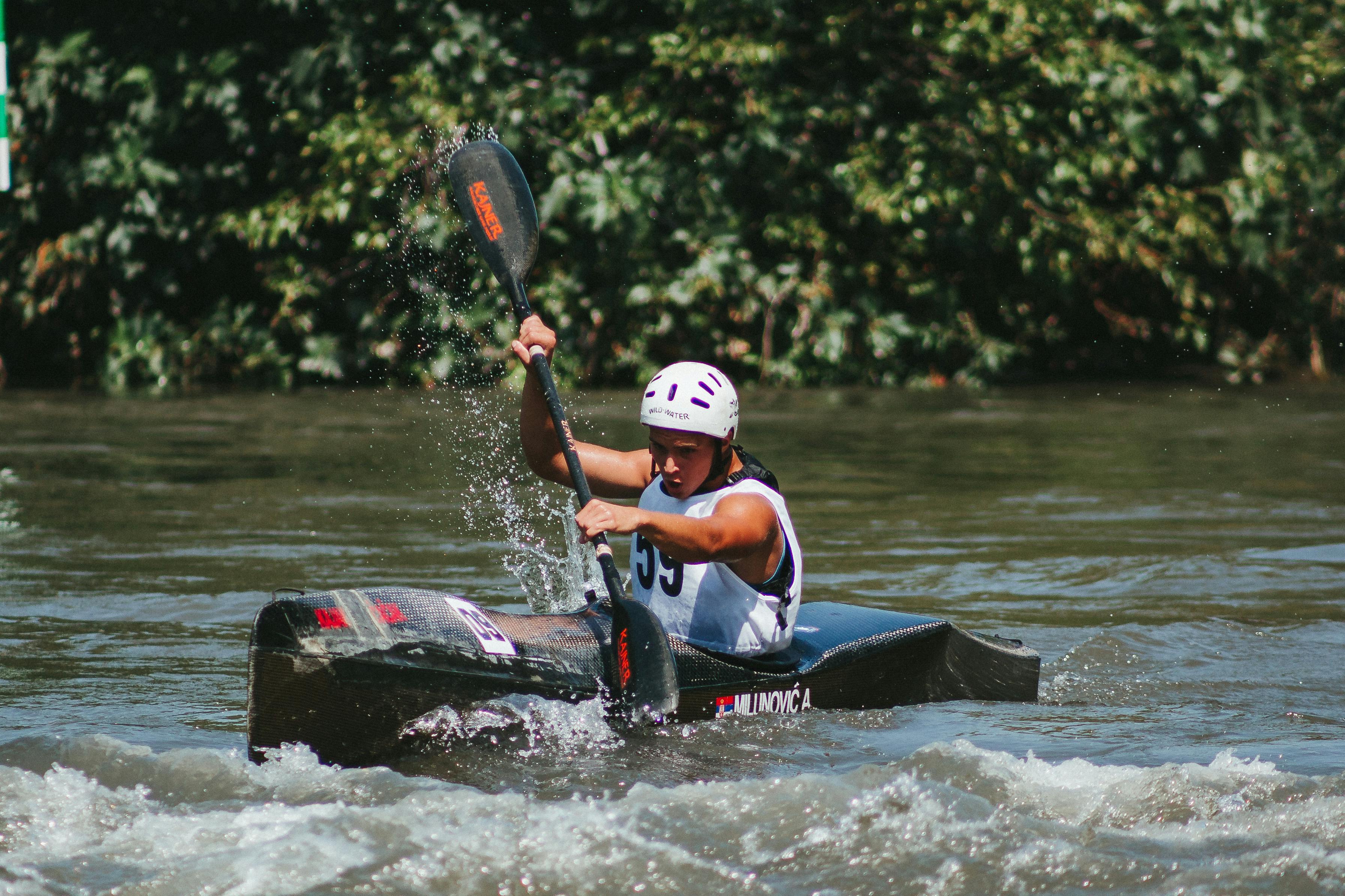 Man in Canoeing Competition · Free Stock Photo
