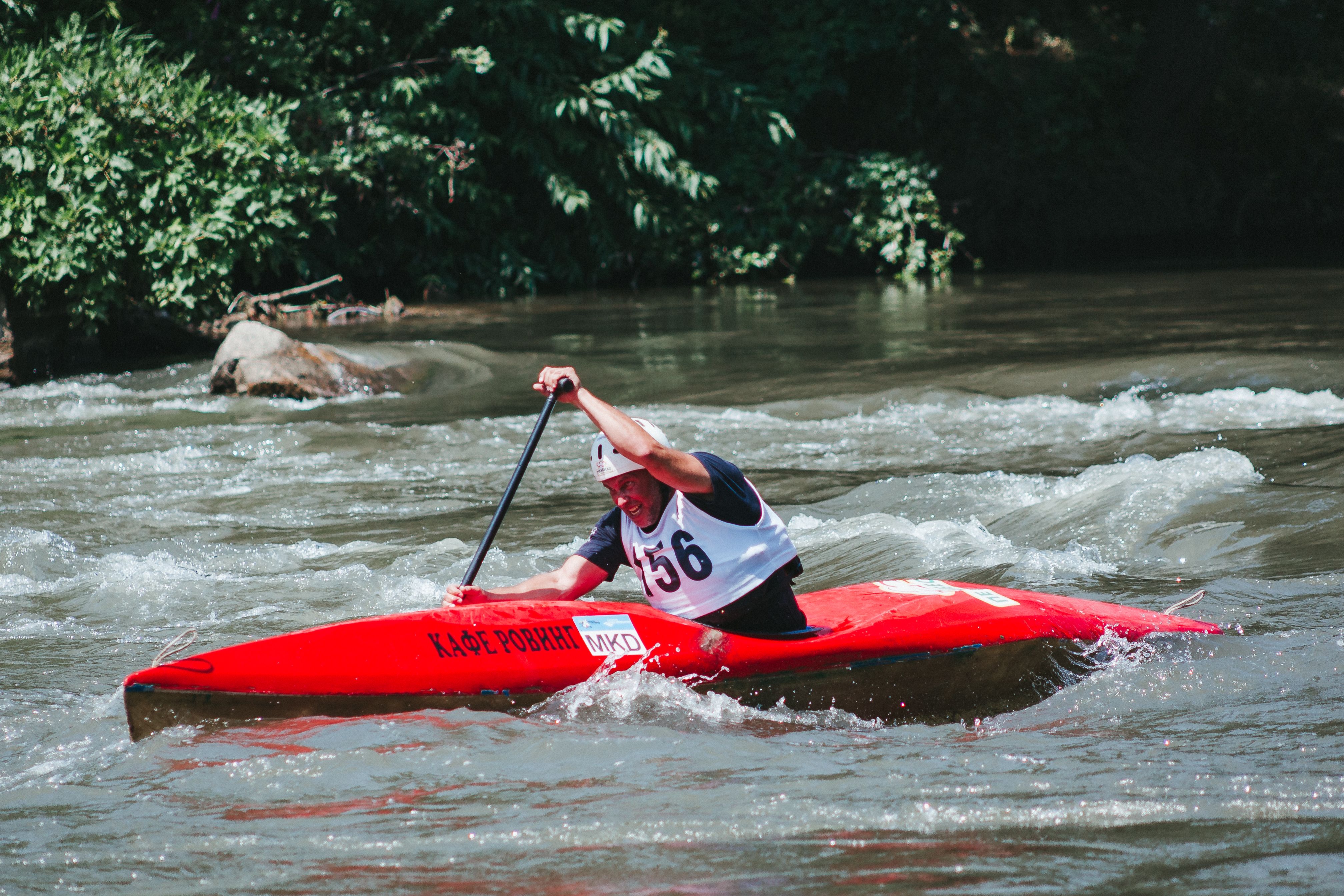 Man Paddling in Canoe in Competition · Free Stock Photo