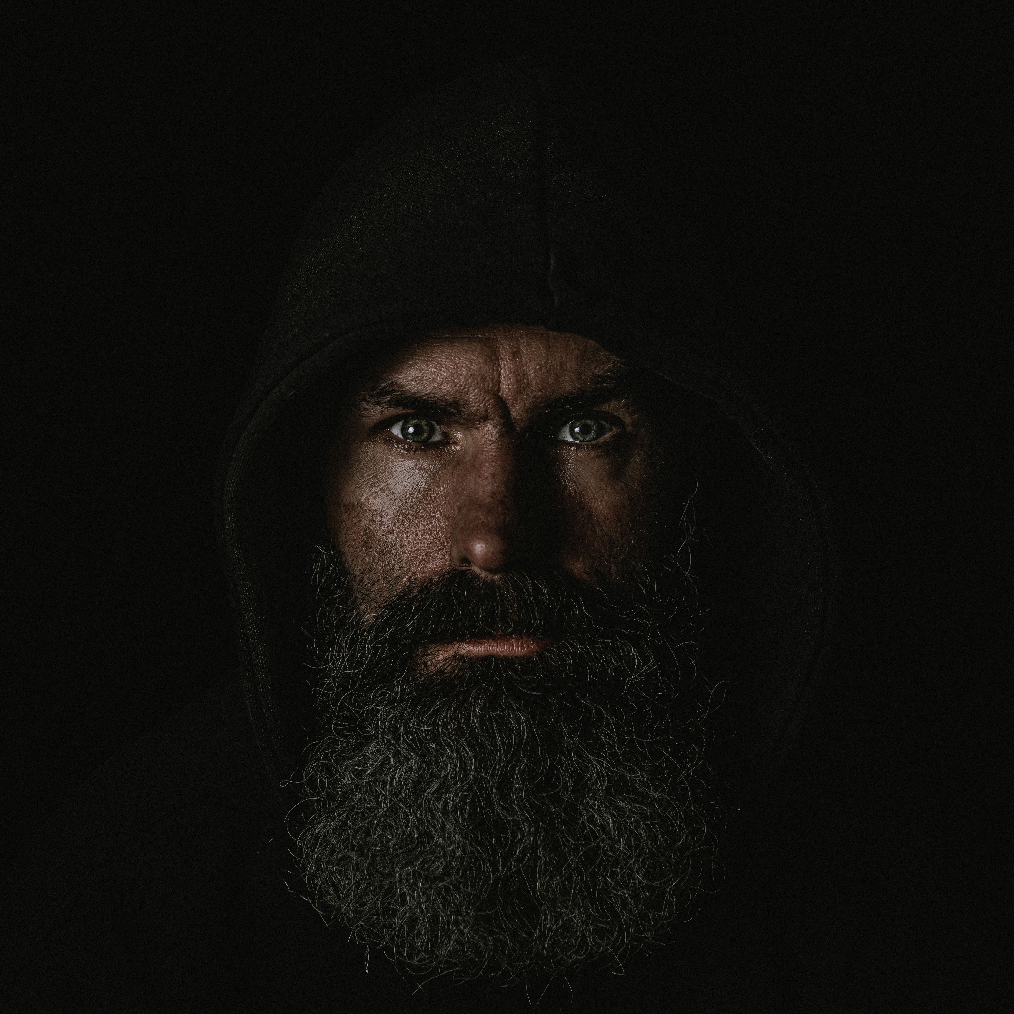 Grayscale Portrait Photo of Man Wearing Holding a Camera · Free Stock Photo