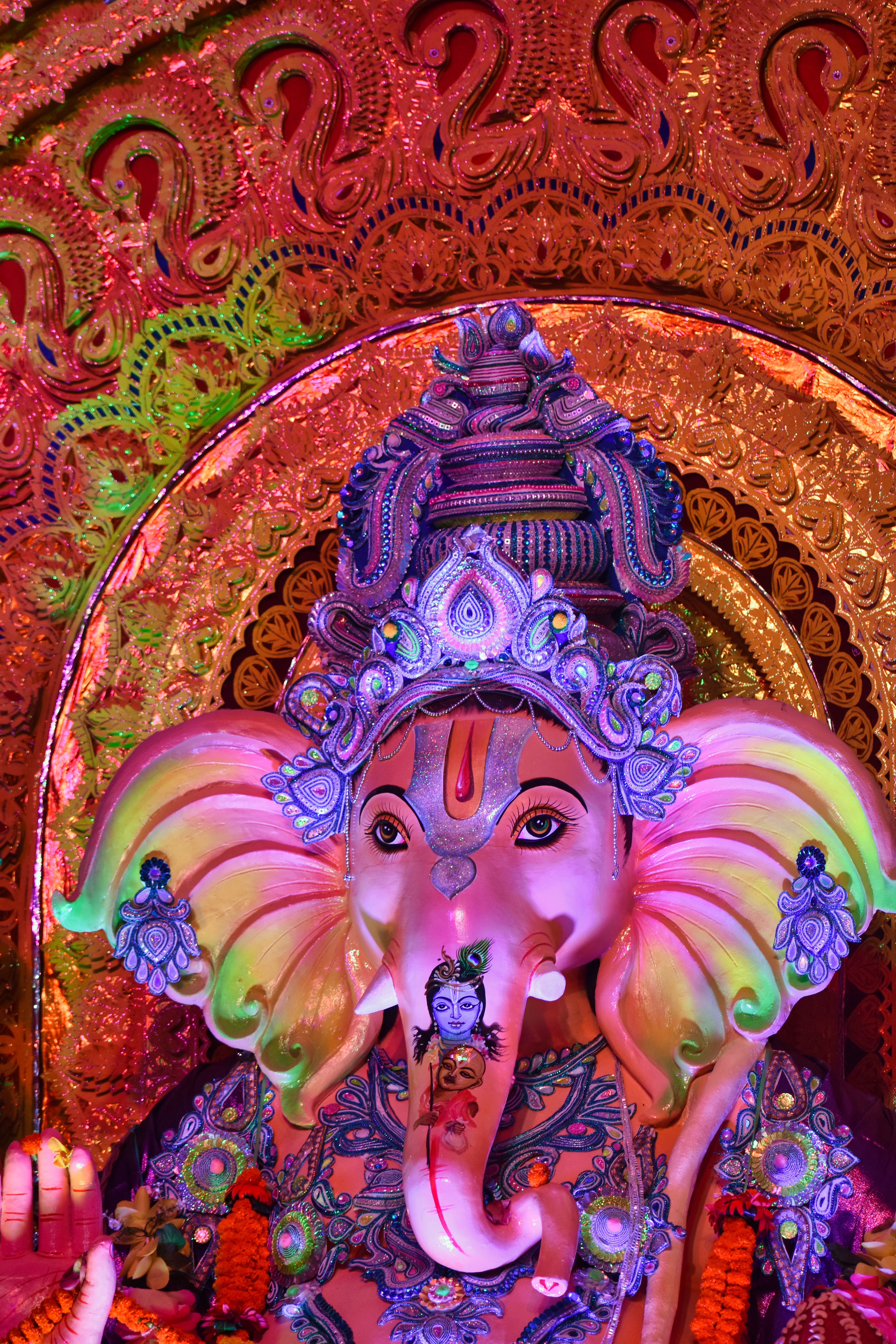 A large statue of ganesh in a colorful room · Free Stock Photo