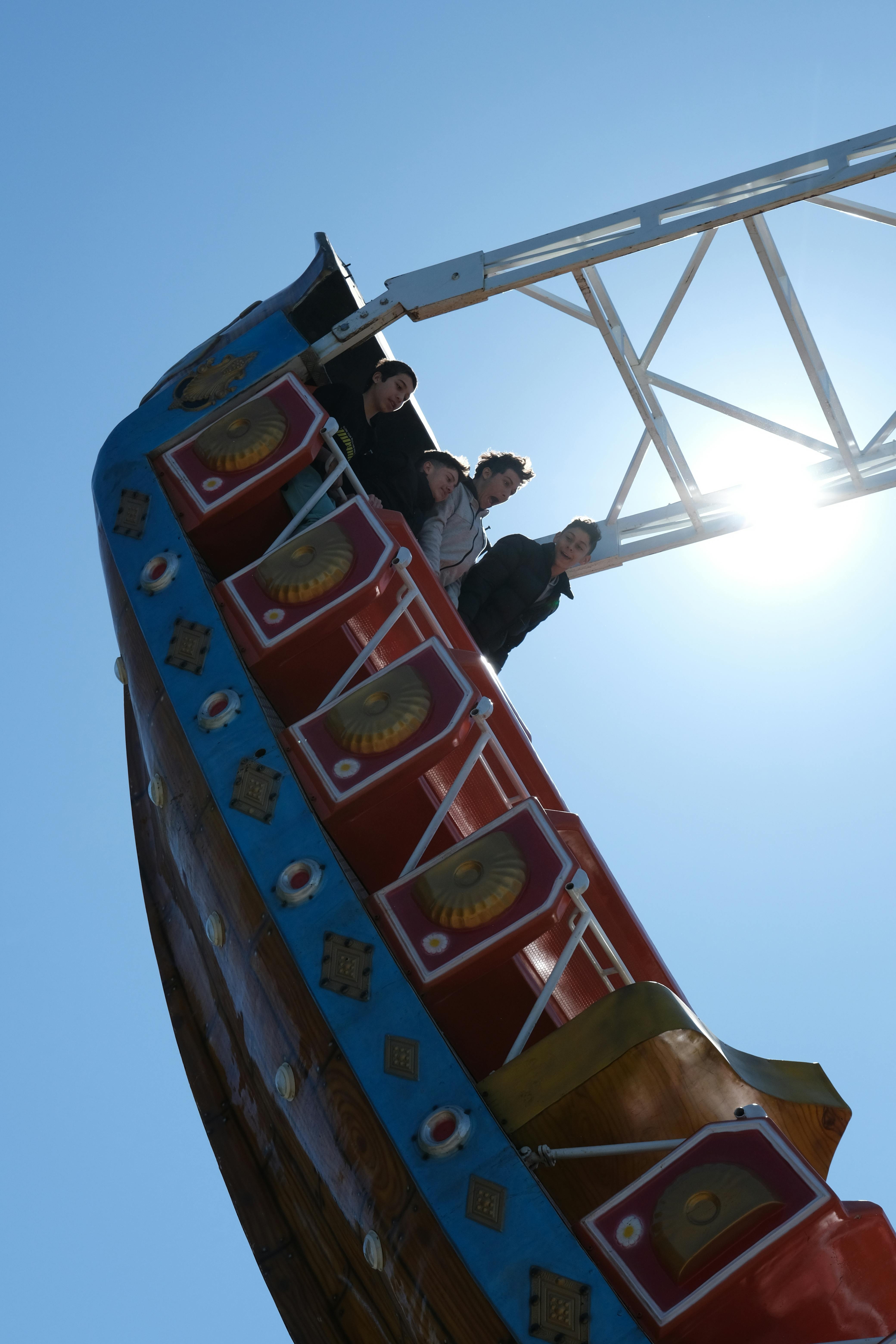 People riding chain carousel in amusement park · Free Stock Photo