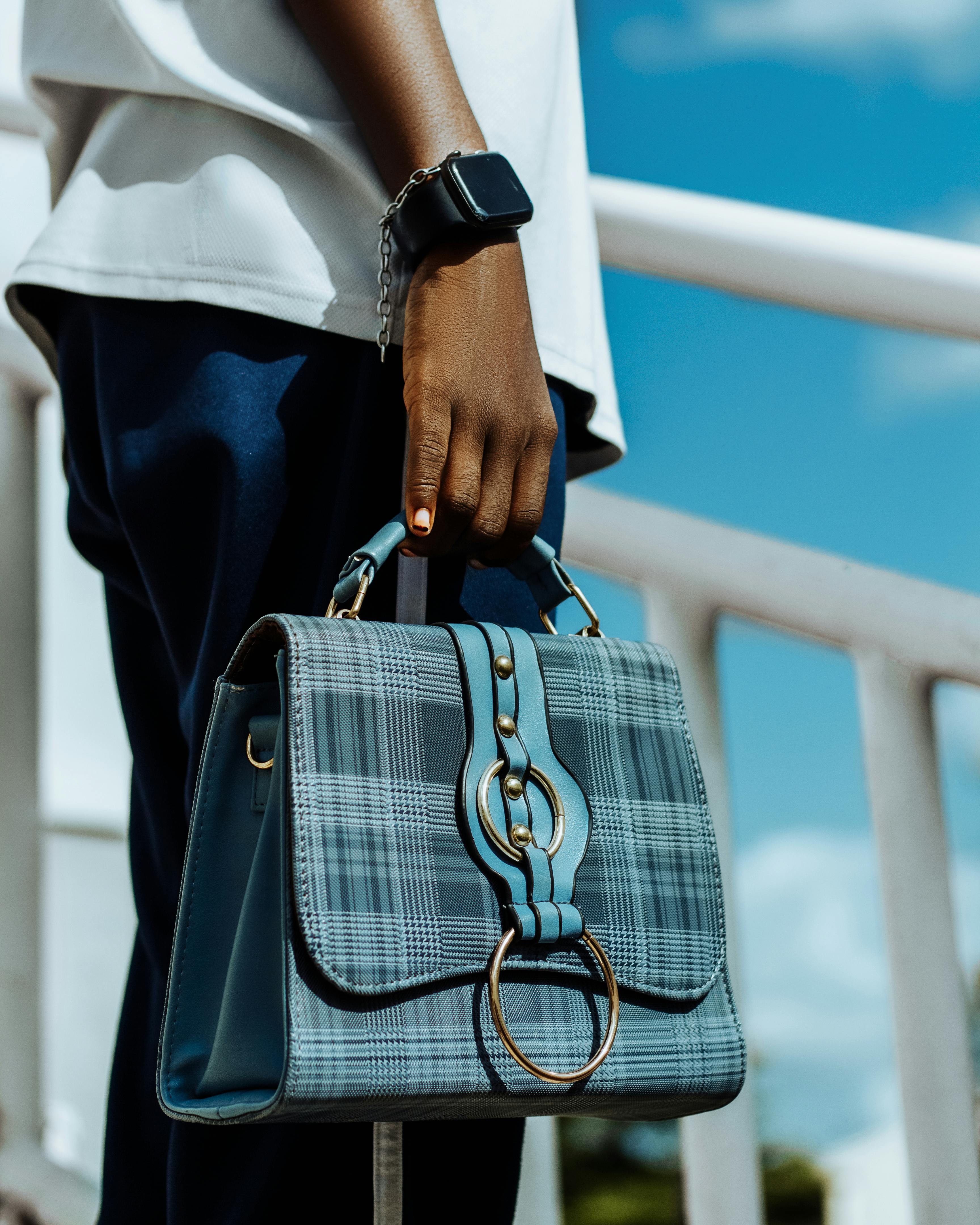 Woman Holding Stylish Handbag · Free Stock Photo
