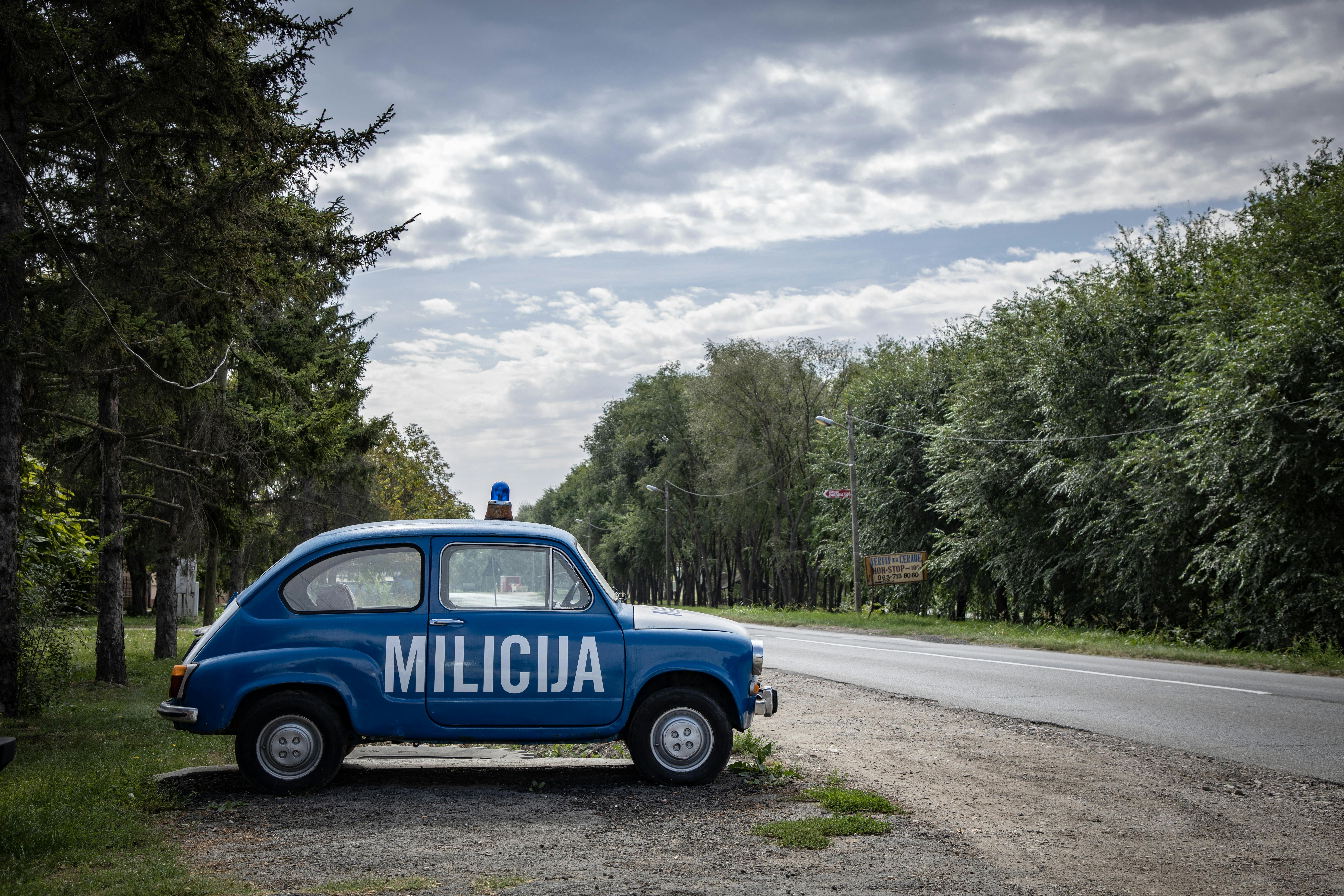 Police Car Parked Near Building · Free Stock Photo