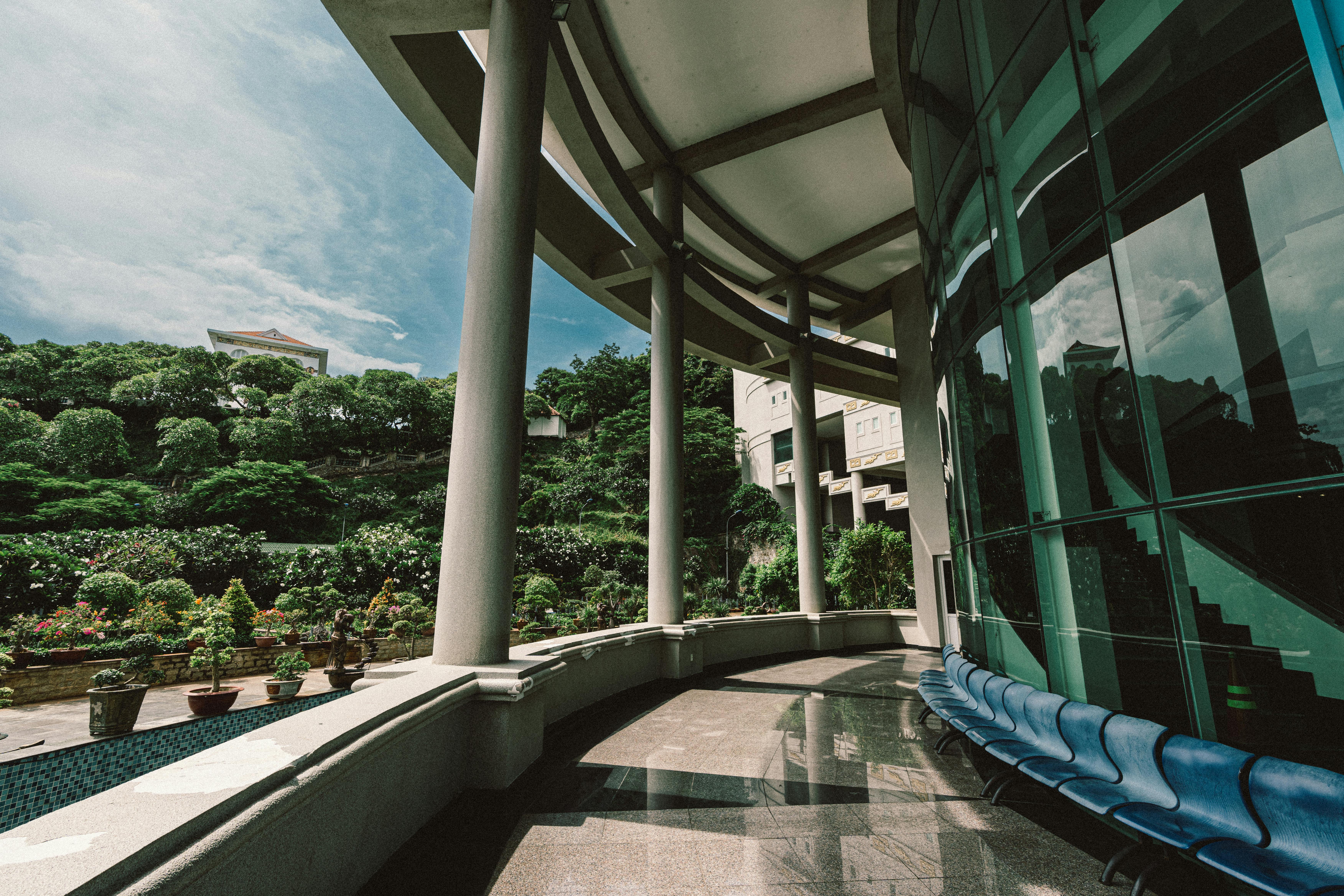 View of a Walkway Outside of a Modern Building with View of a Garden ...