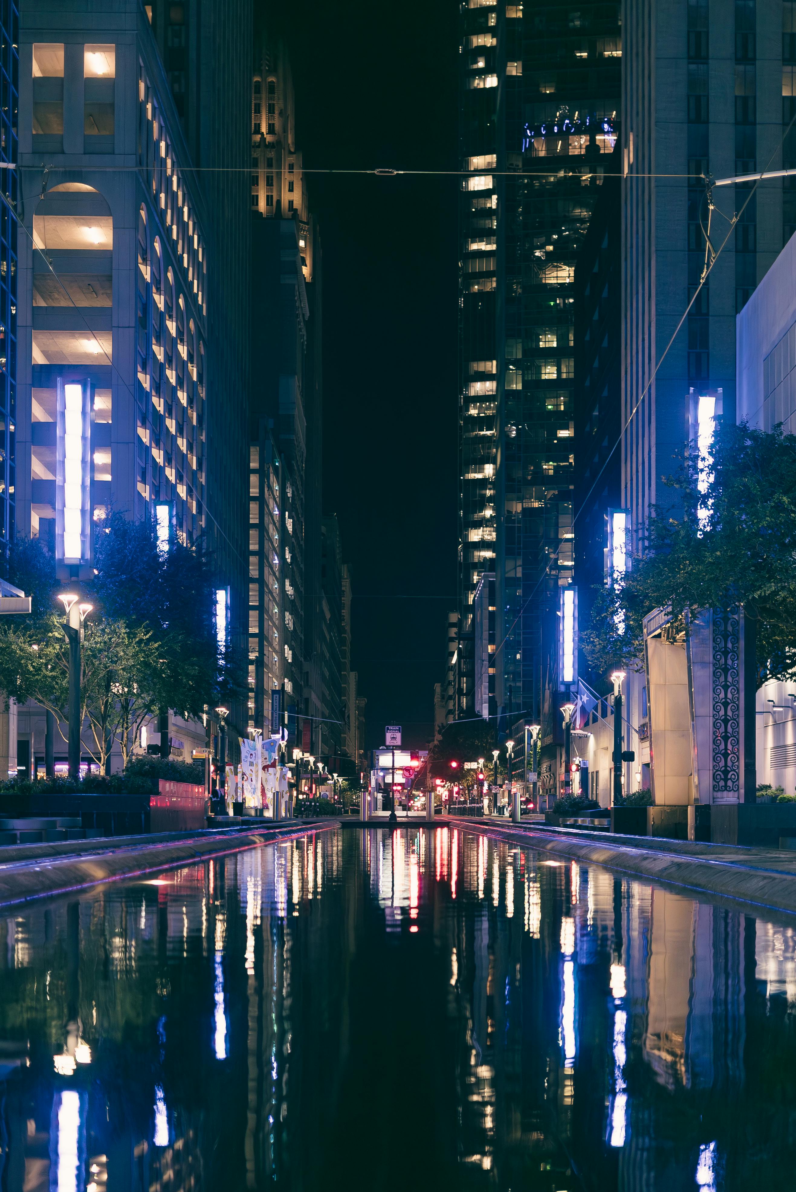 Canal among Illuminated Skyscraper at Night · Free Stock Photo