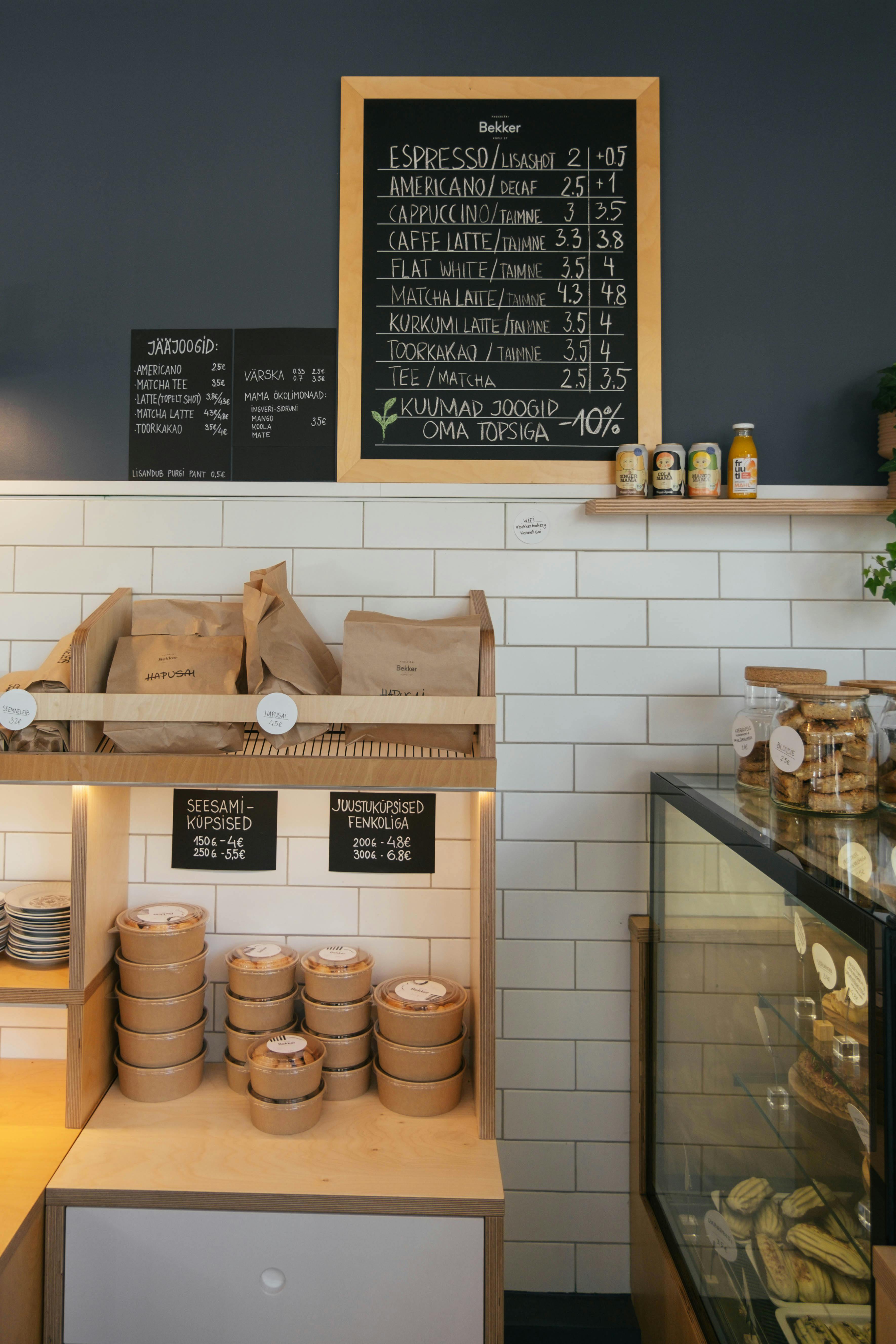 View of a Counter, Display Cabinet and a Menu Board in a Cafe · Free ...