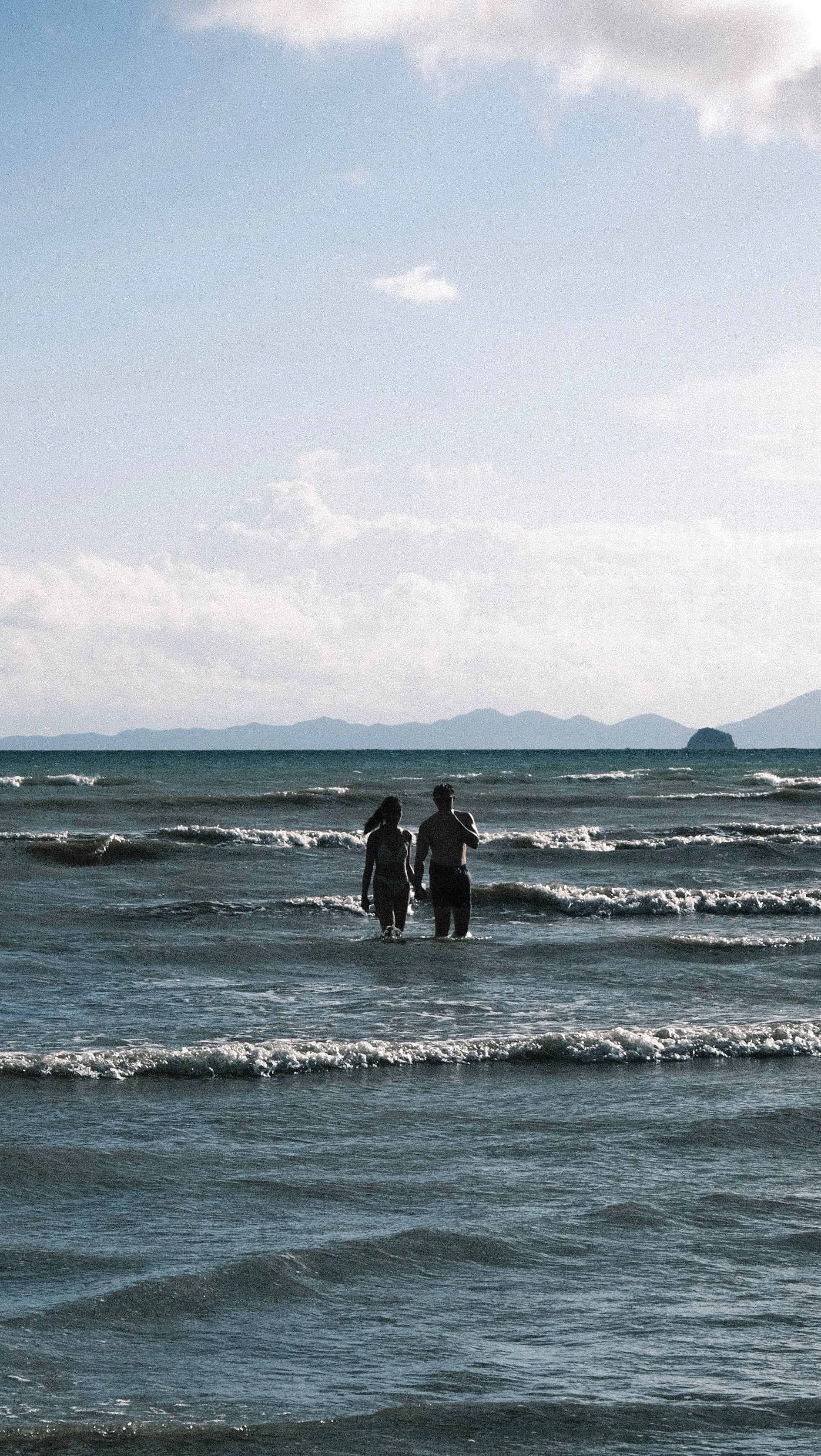 Back View of a Couple Doing Holding hands · Free Stock Photo