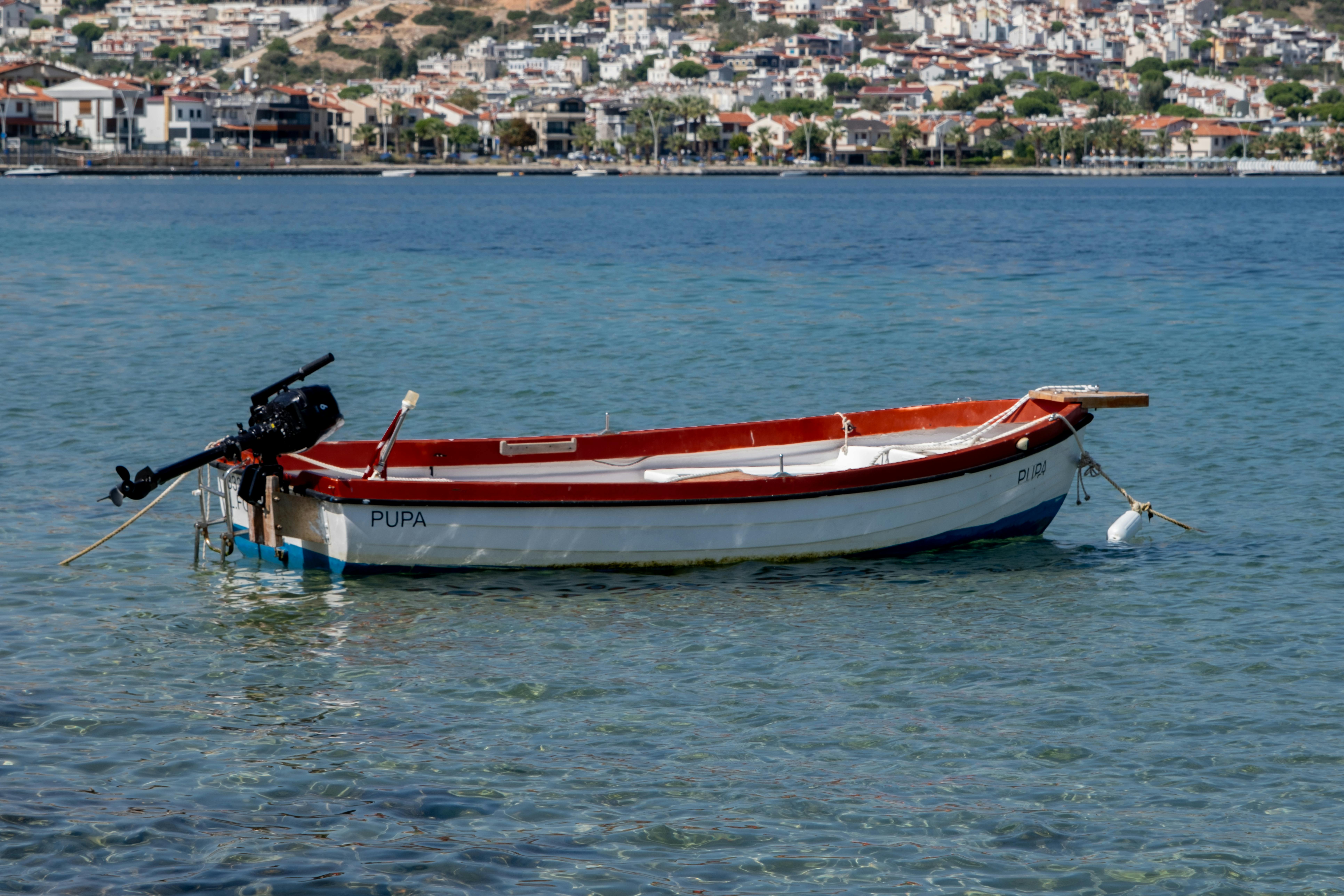 Empty Motorboat on Sea Coast · Free Stock Photo