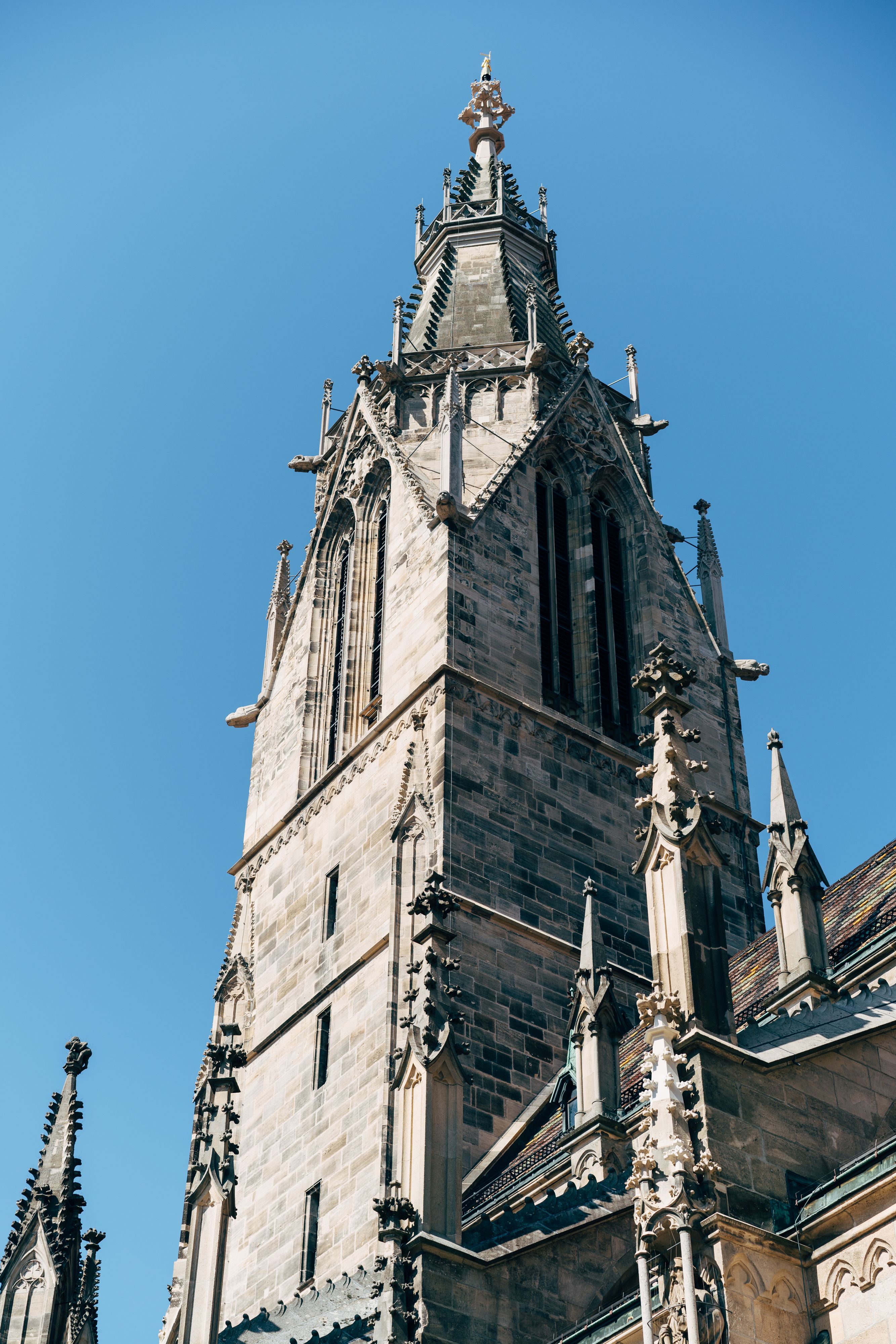 A tall spire with a clock on it · Free Stock Photo