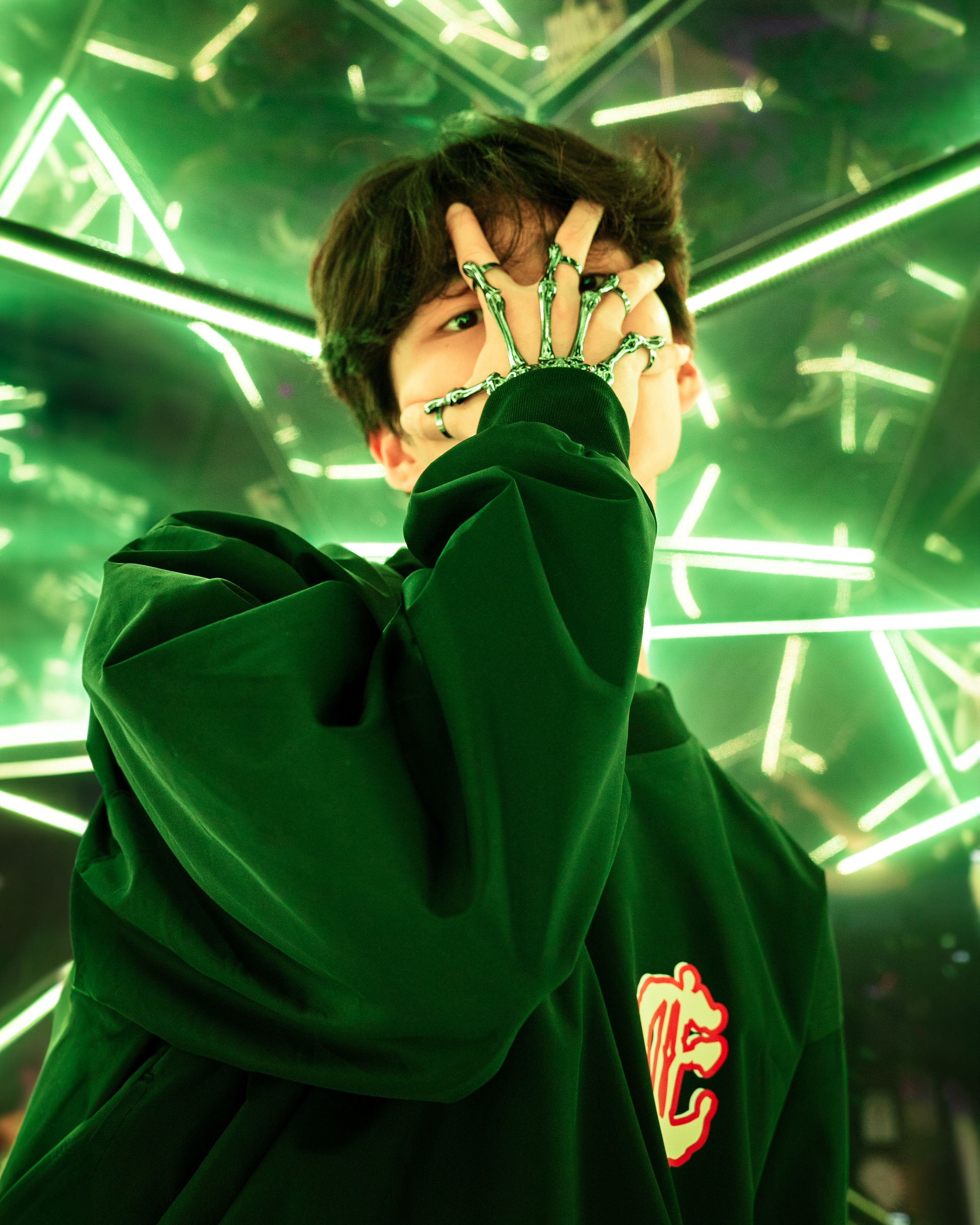 Portrait of a Young Man Posing under a Green Light · Free Stock Photo