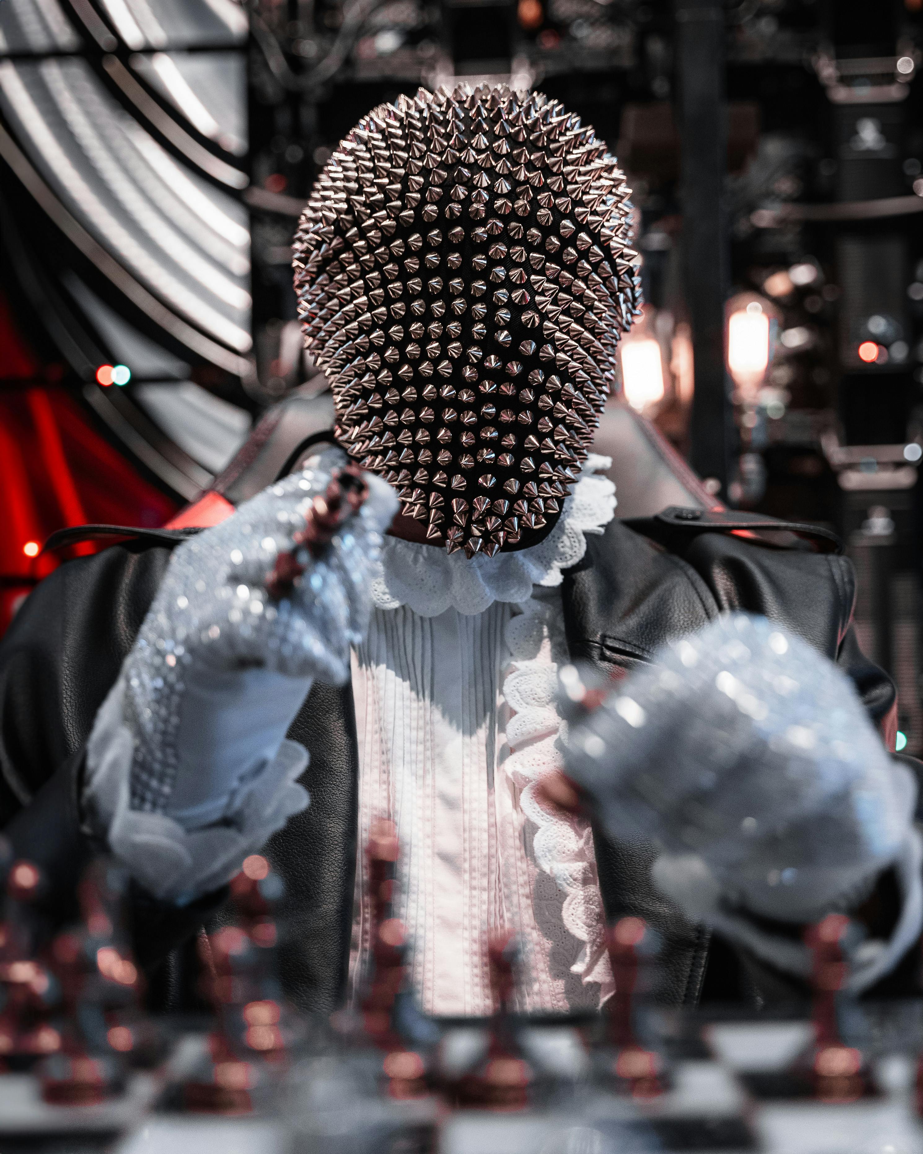 Person Wearing a Studded Mask Playing Chess · Free Stock Photo