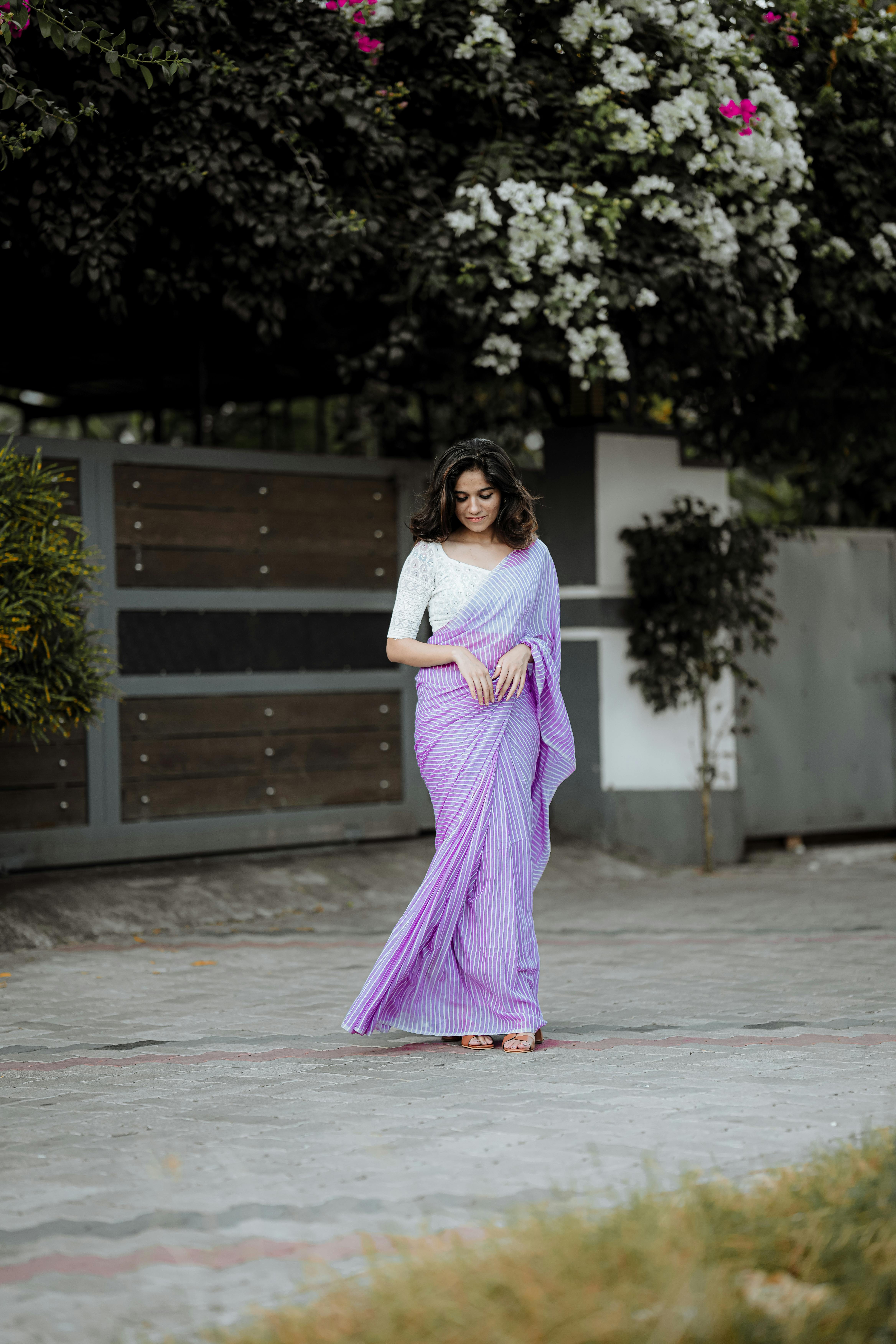 Young Elegant Woman in a Saree Standing Outside · Free Stock Photo