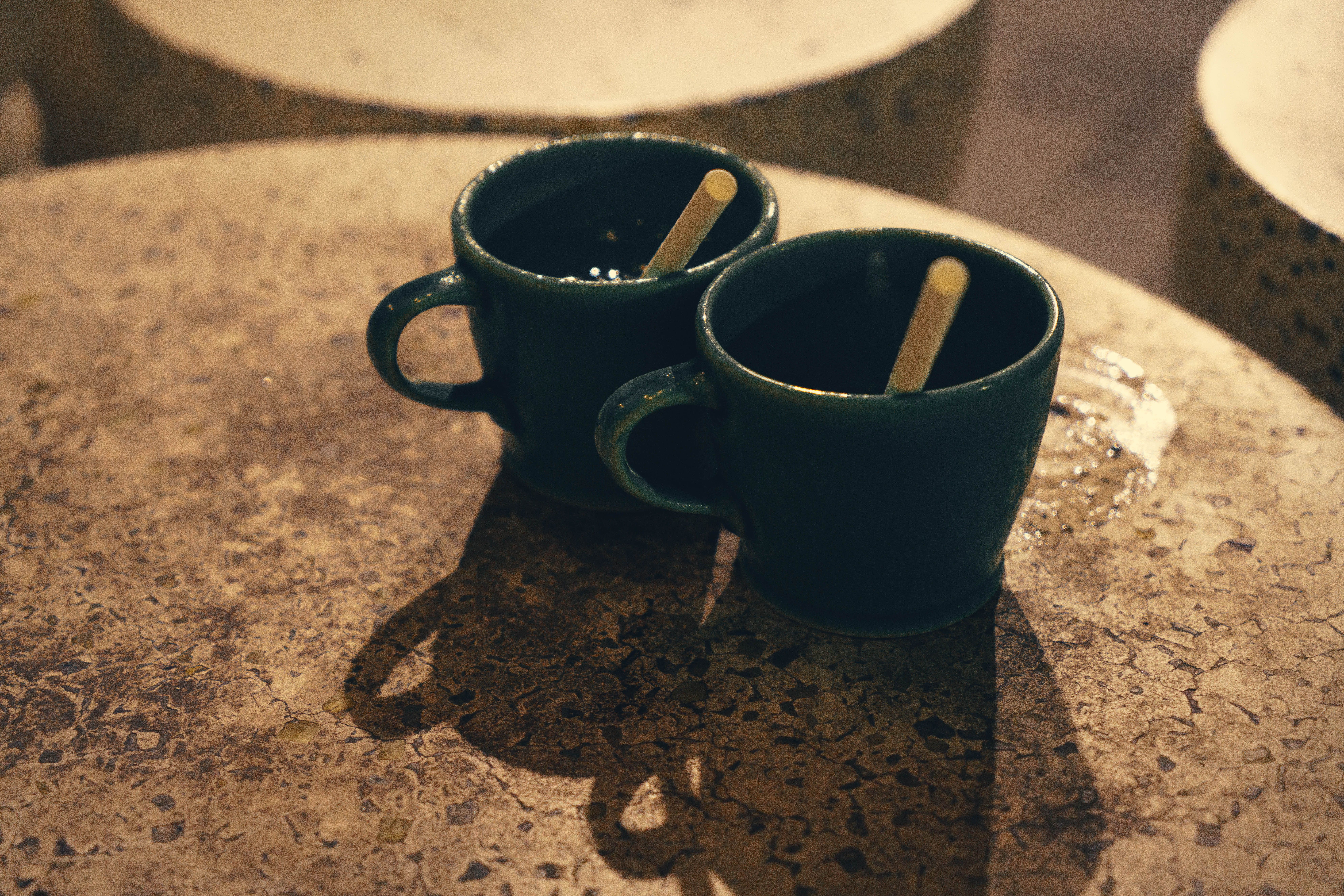Two Cups with Straws on the Table · Free Stock Photo