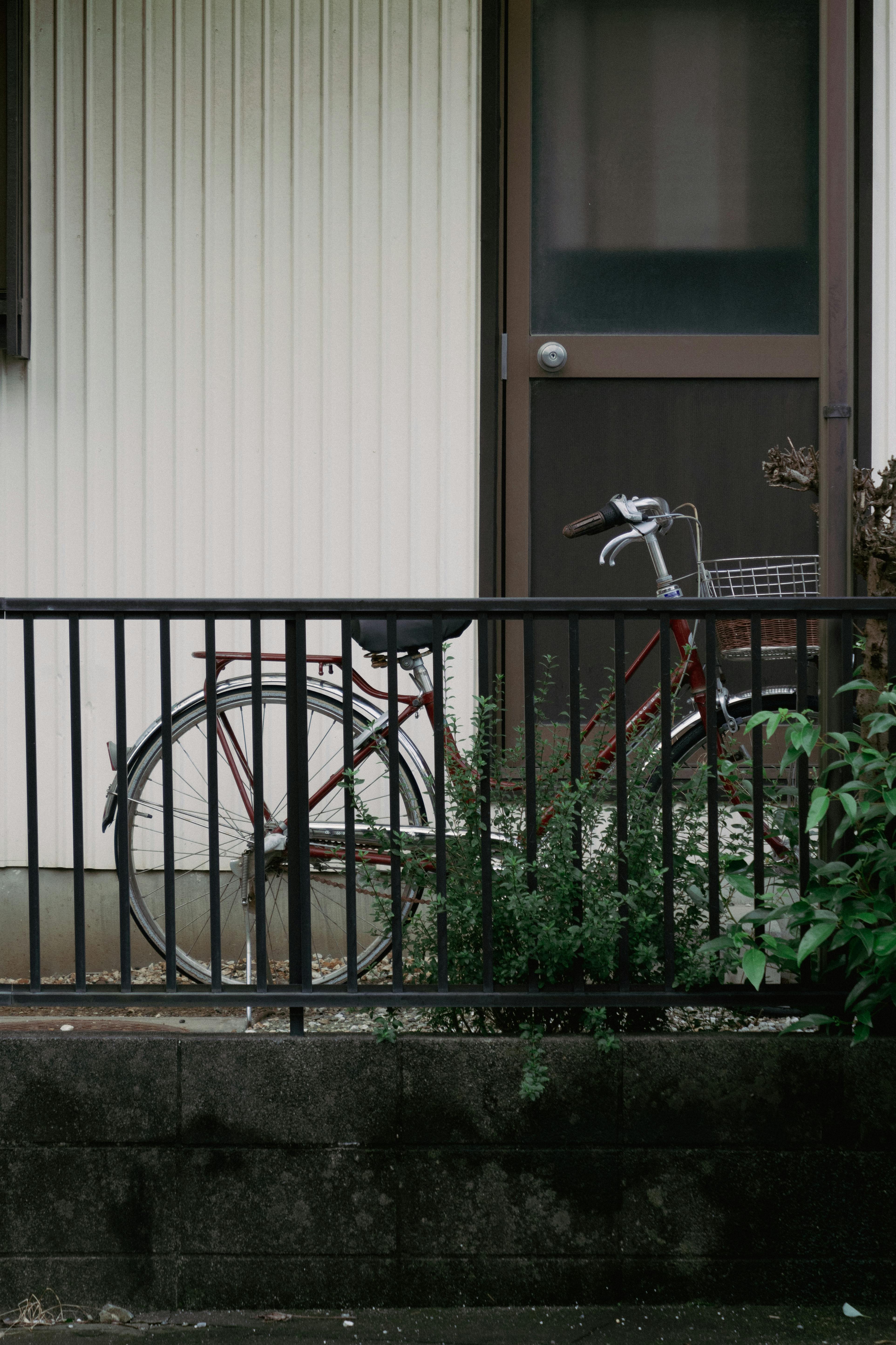 Bicycle behind Railing · Free Stock Photo