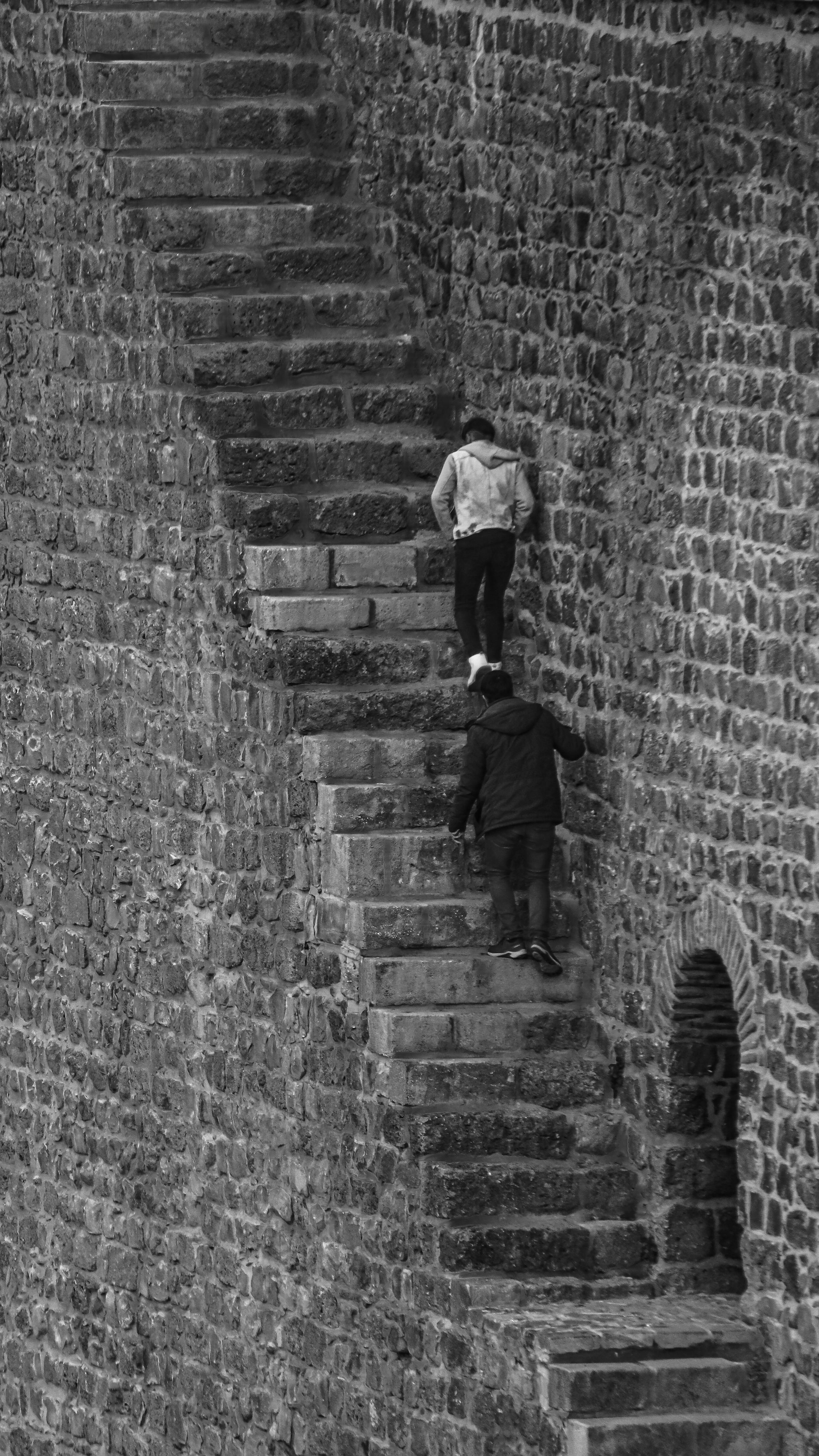 Two People Walking on Stairs in a Castle · Free Stock Photo