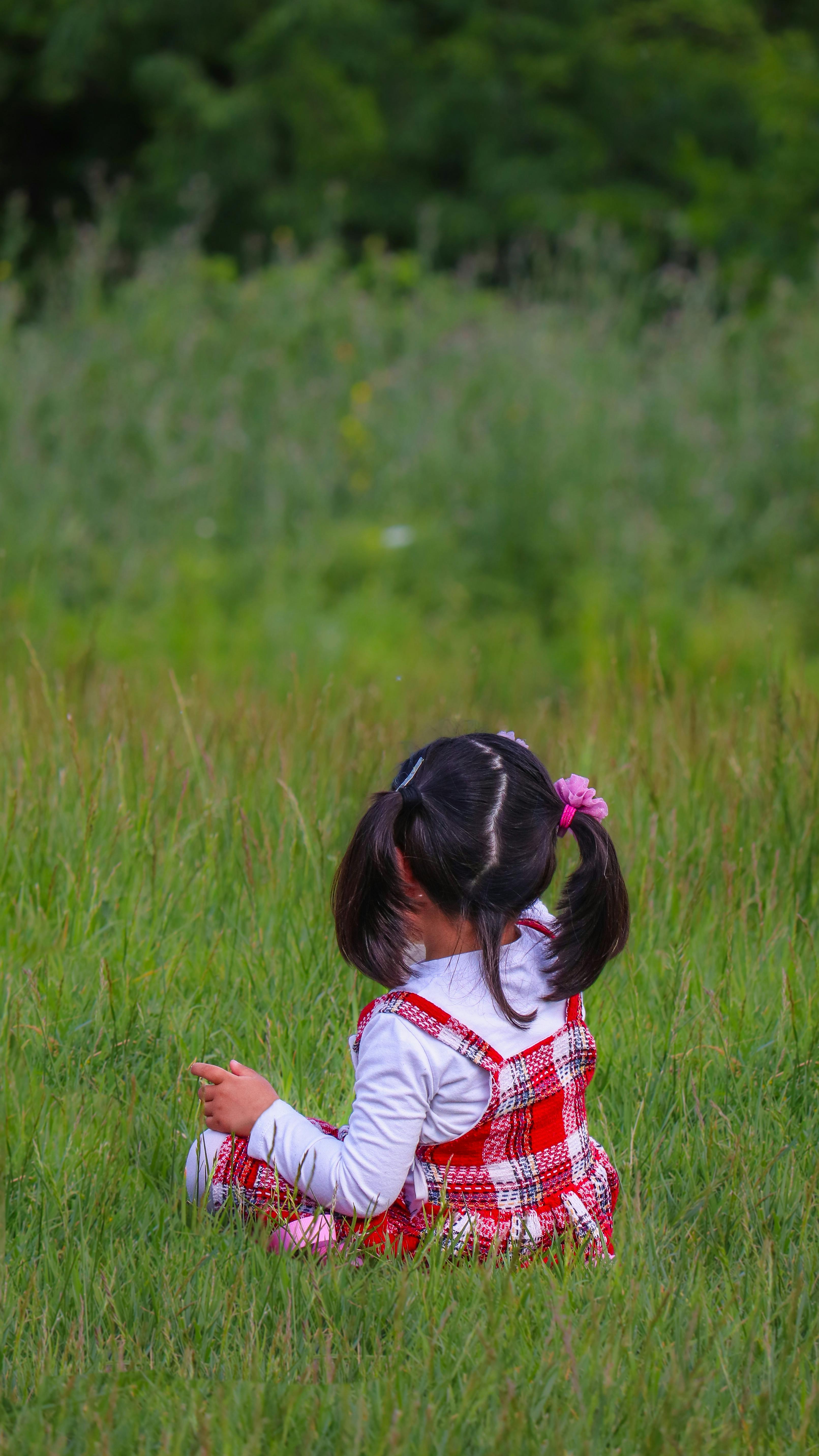 Girl Sitting in Grass · Free Stock Photo