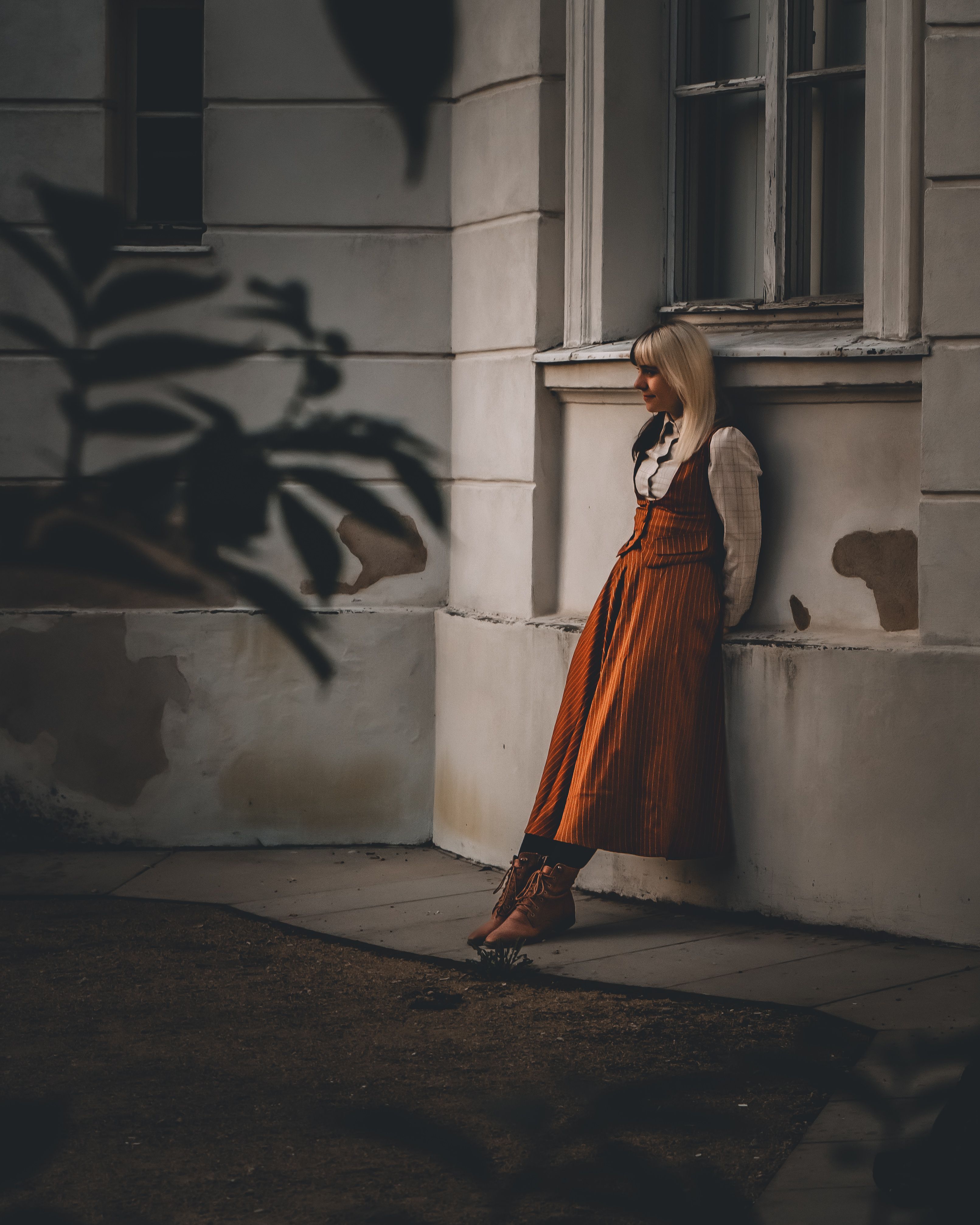 Teenage Boy Standing and Leaning against a Building · Free Stock Photo