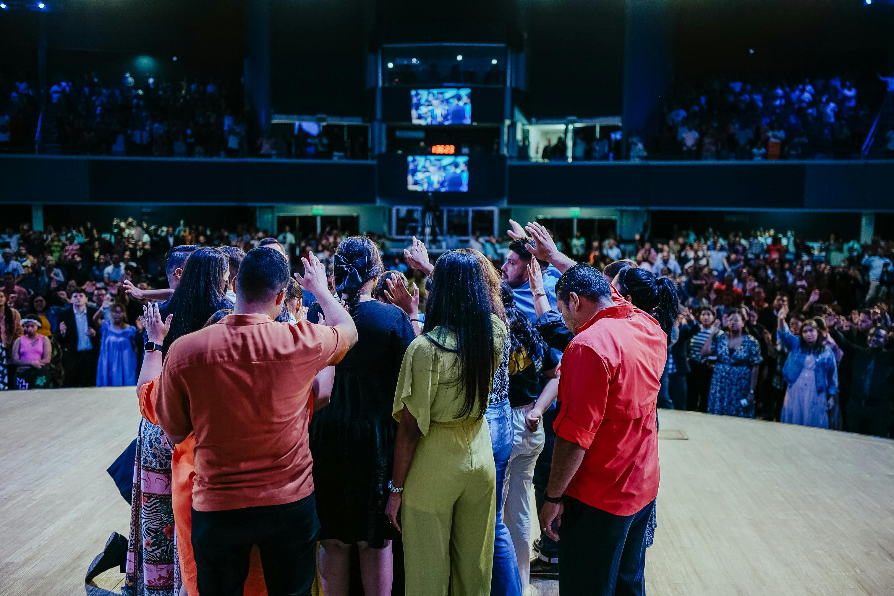 People Standing on Stage and Crowd Standing behind · Free Stock Photo