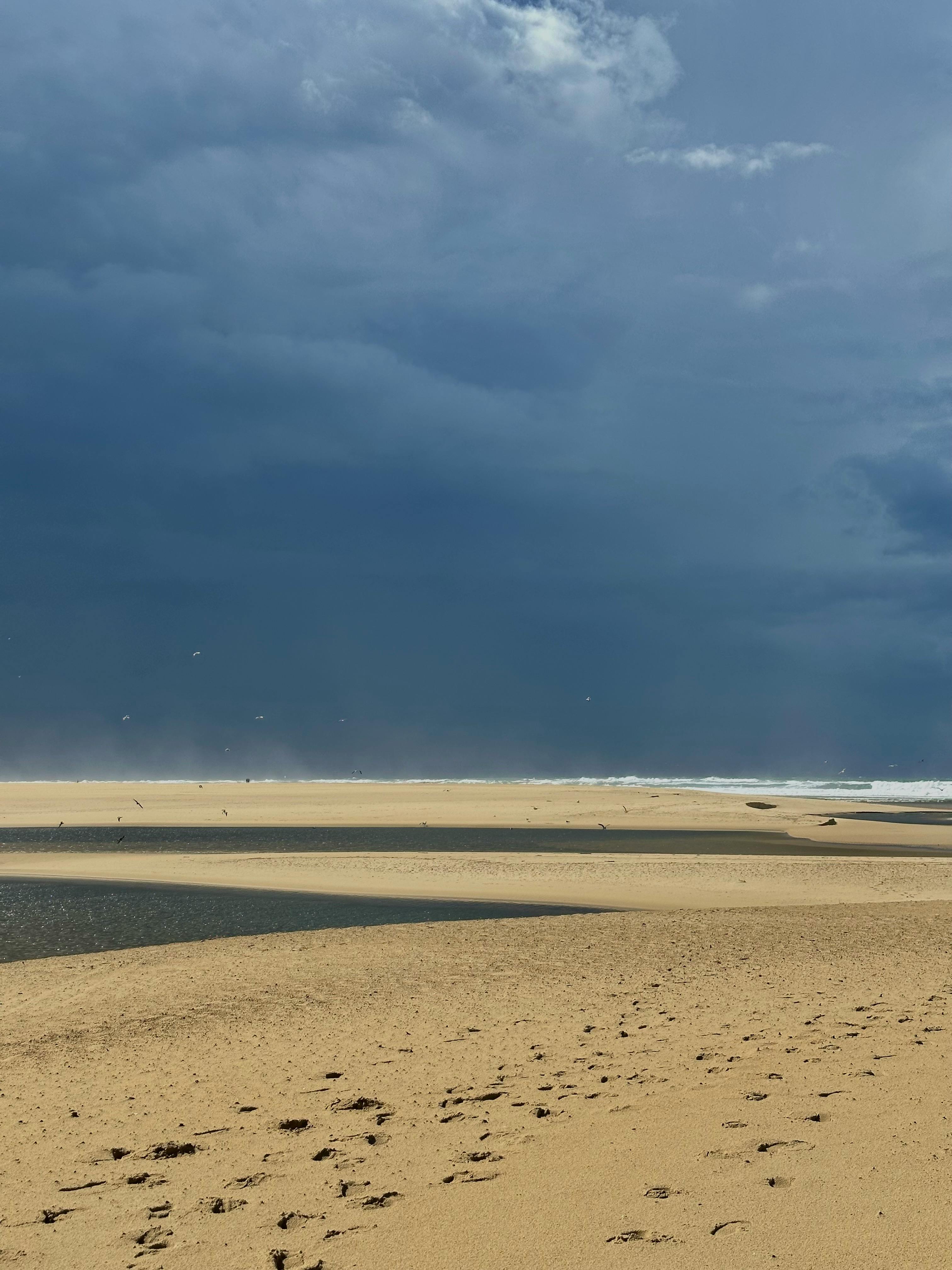Rain Clouds over Beach on Sea Shore · Free Stock Photo
