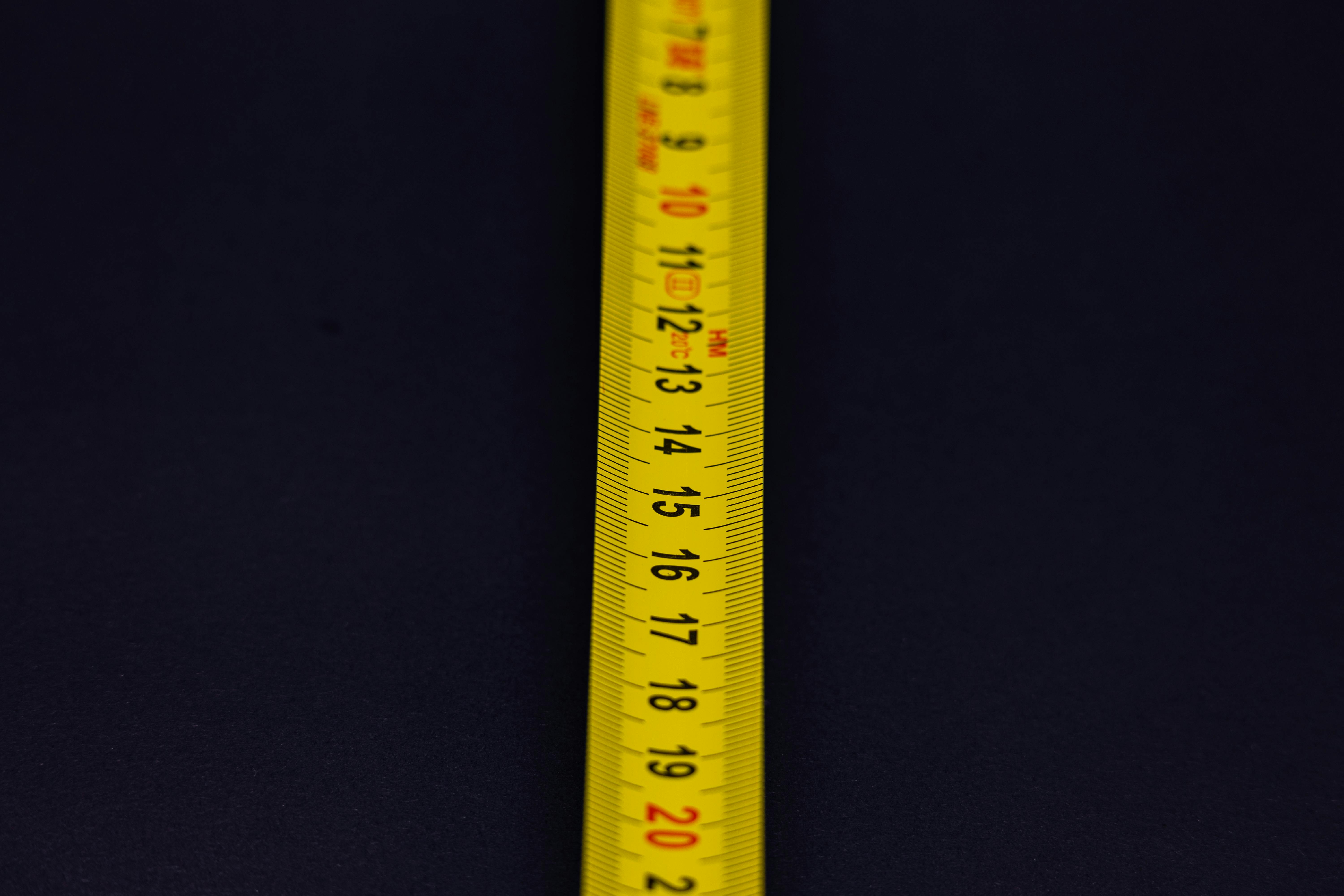 Woman getting on scales in studio · Free Stock Photo