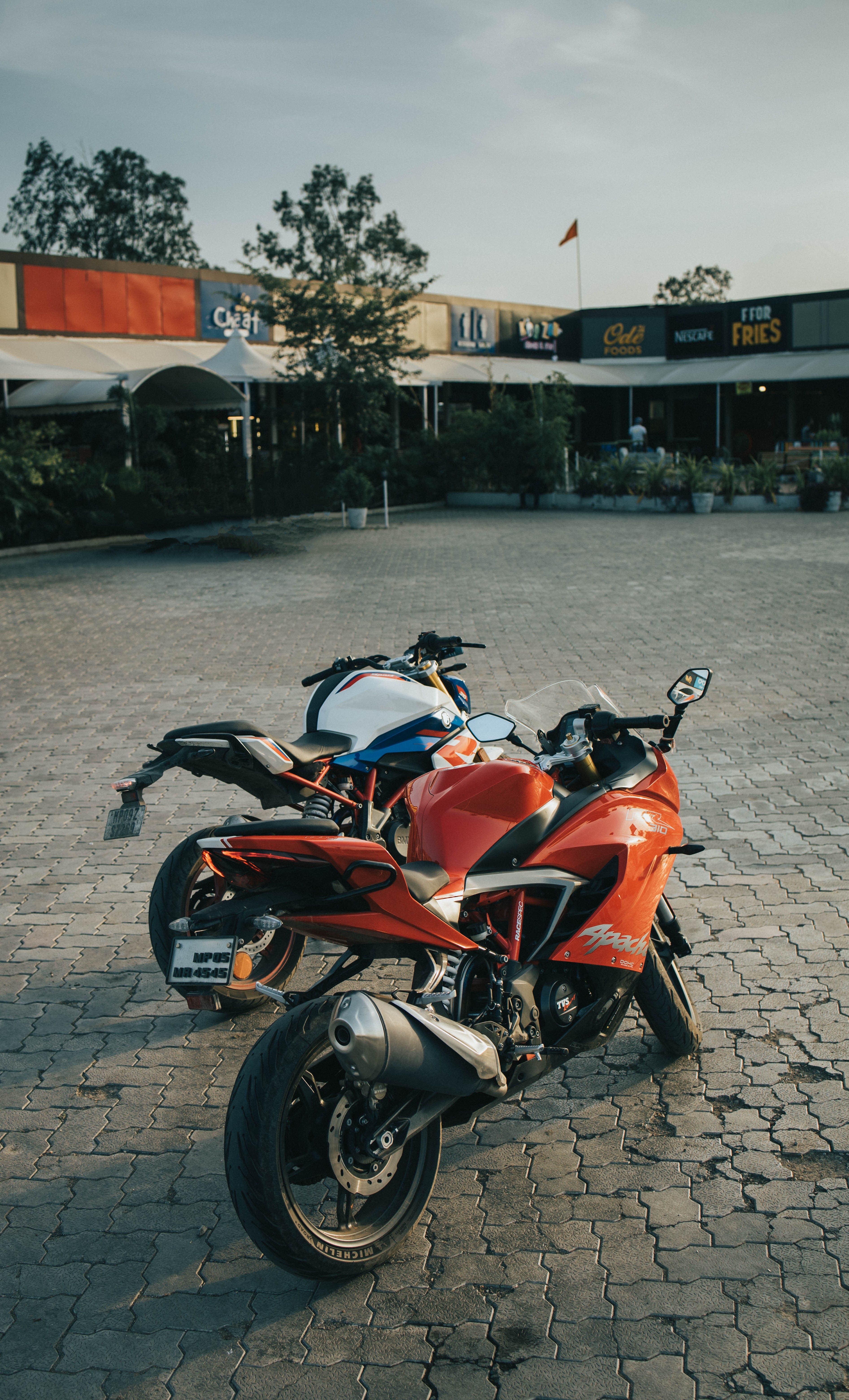 Two Motorcycles Parked on the Pavement · Free Stock Photo