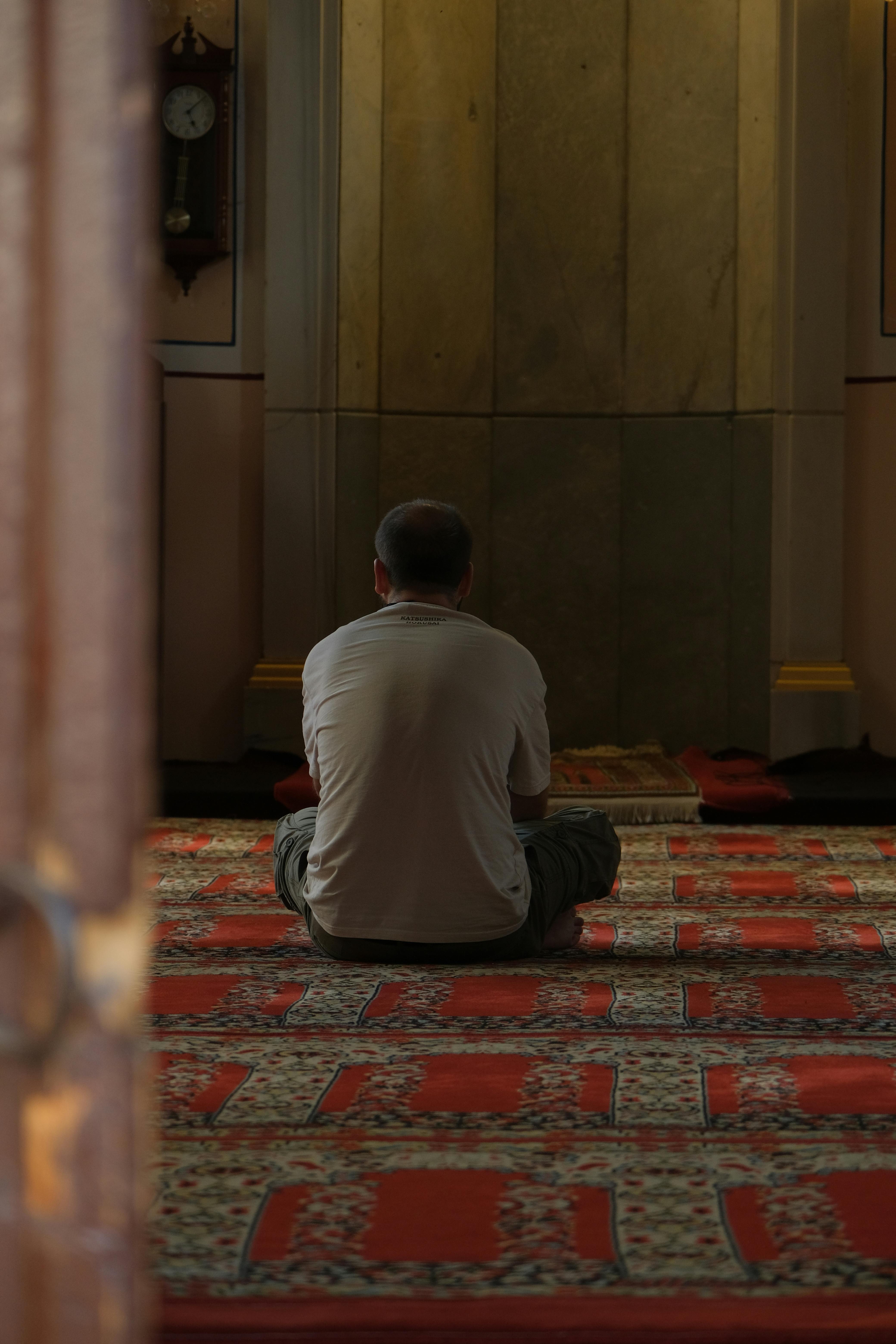 A Man Sitting in a Mosque · Free Stock Photo