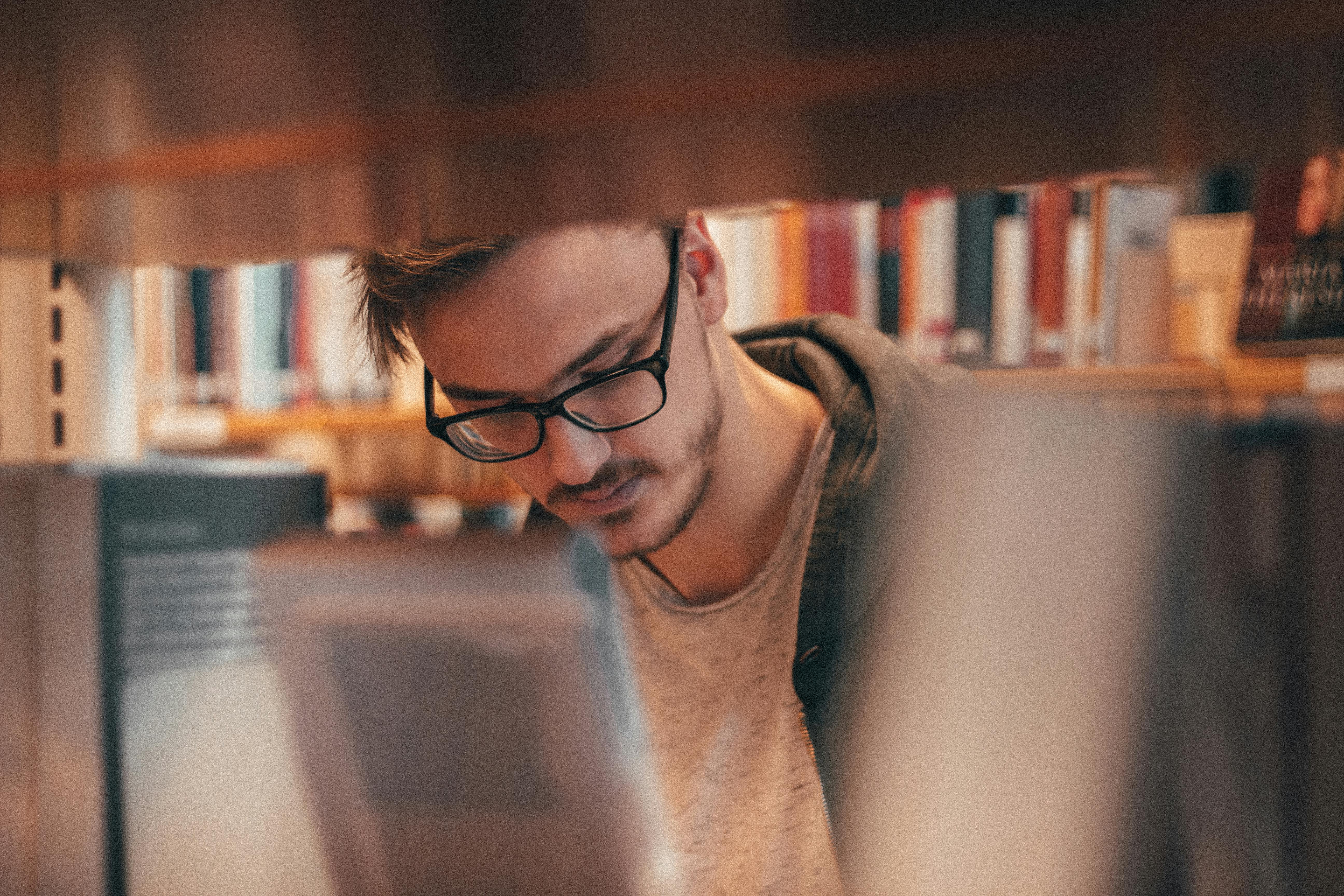Photo of Man Holding a Book · Free Stock Photo
