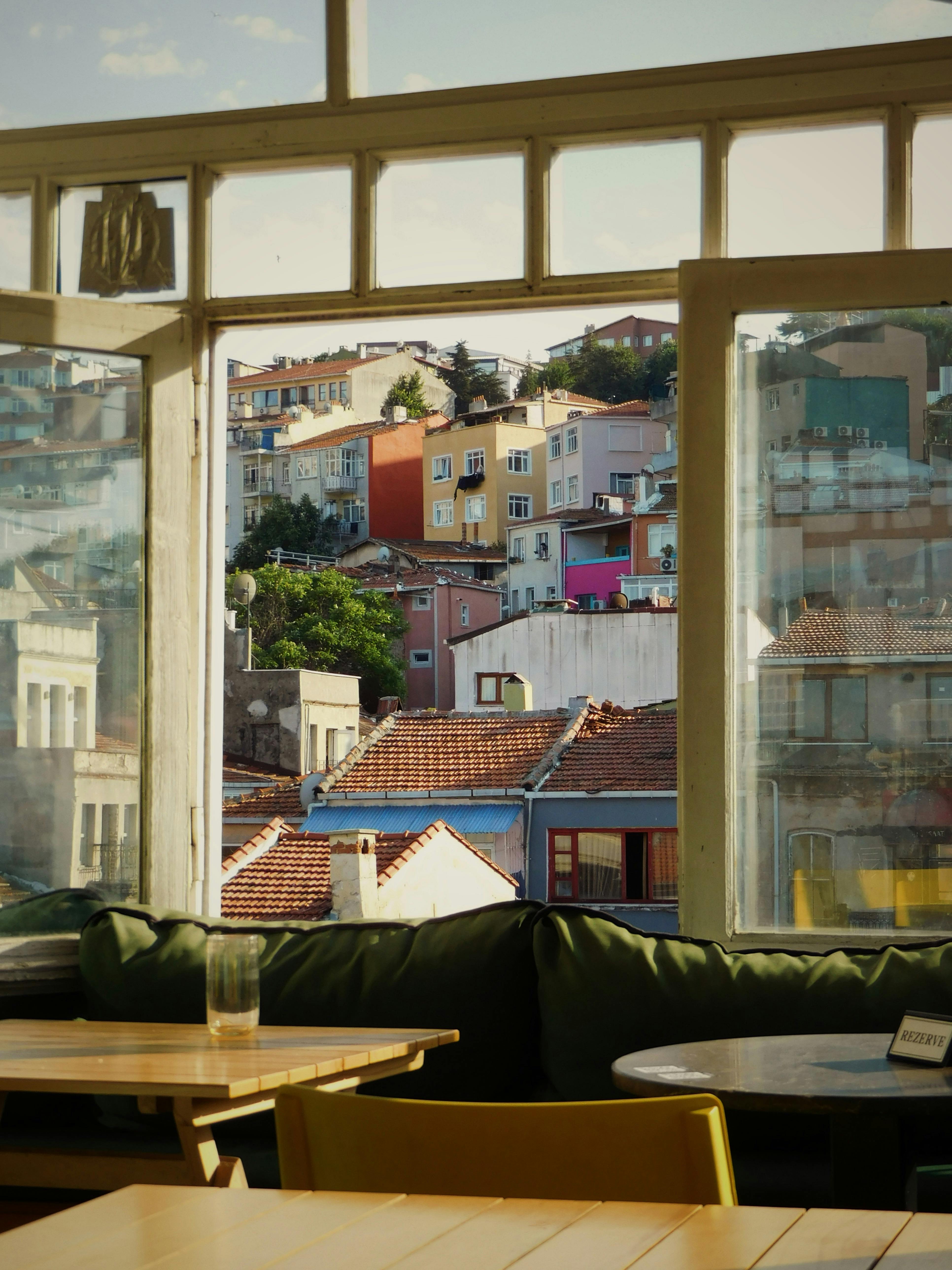 Town Buildings behind Windows · Free Stock Photo