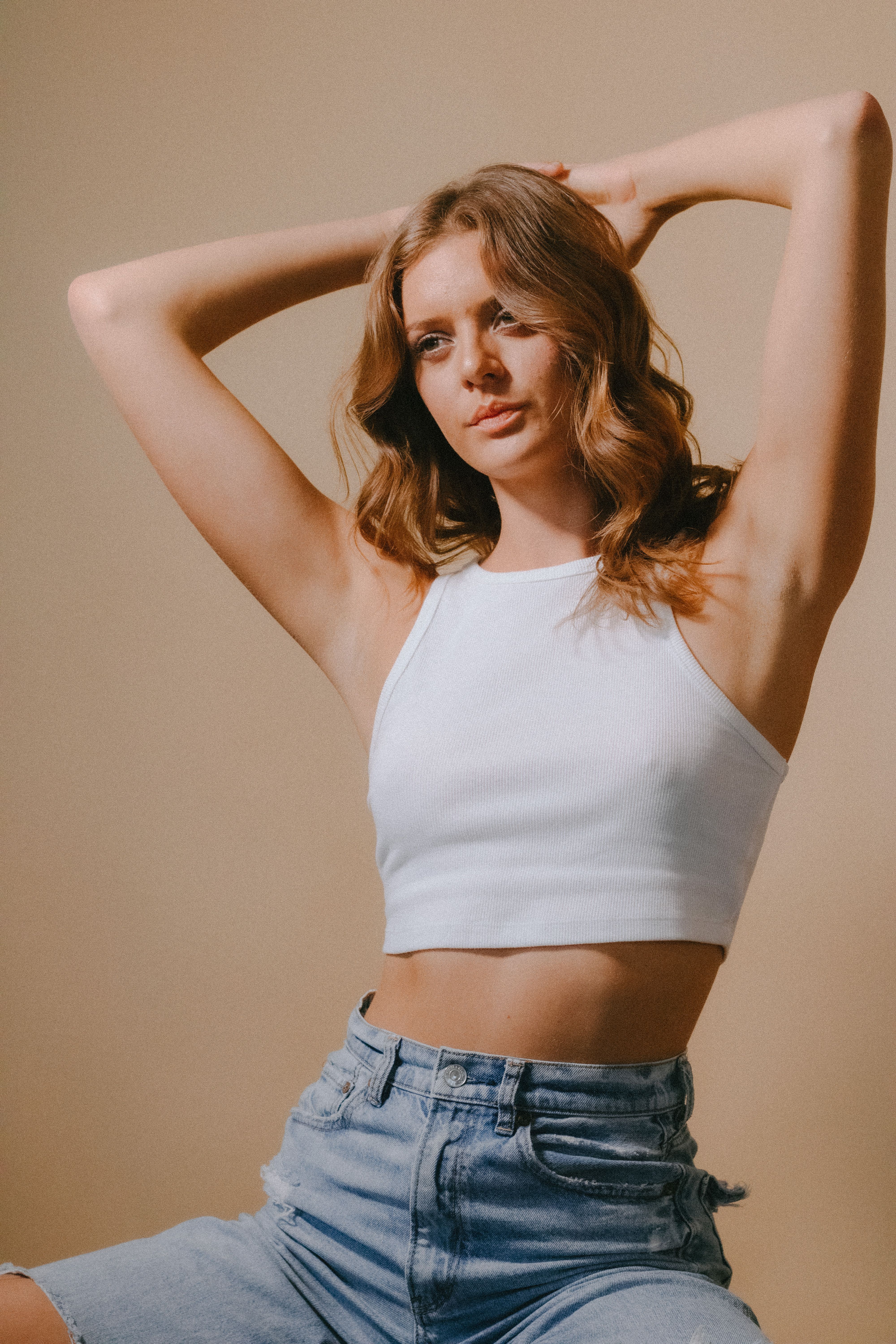 Beautiful Young Woman in Crop Top Posing in Studio · Free Stock Photo