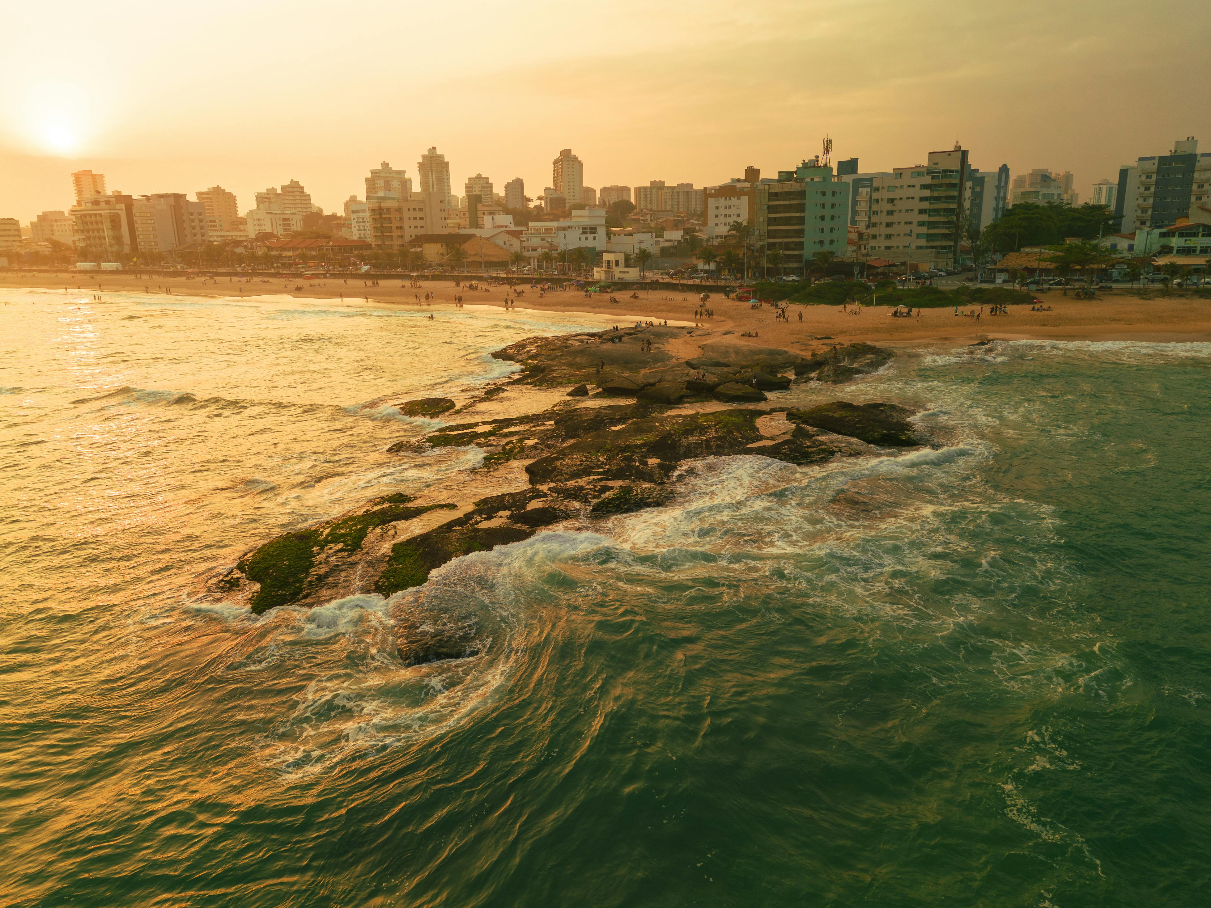Sandy Beach with Rocks in Sea · Free Stock Photo