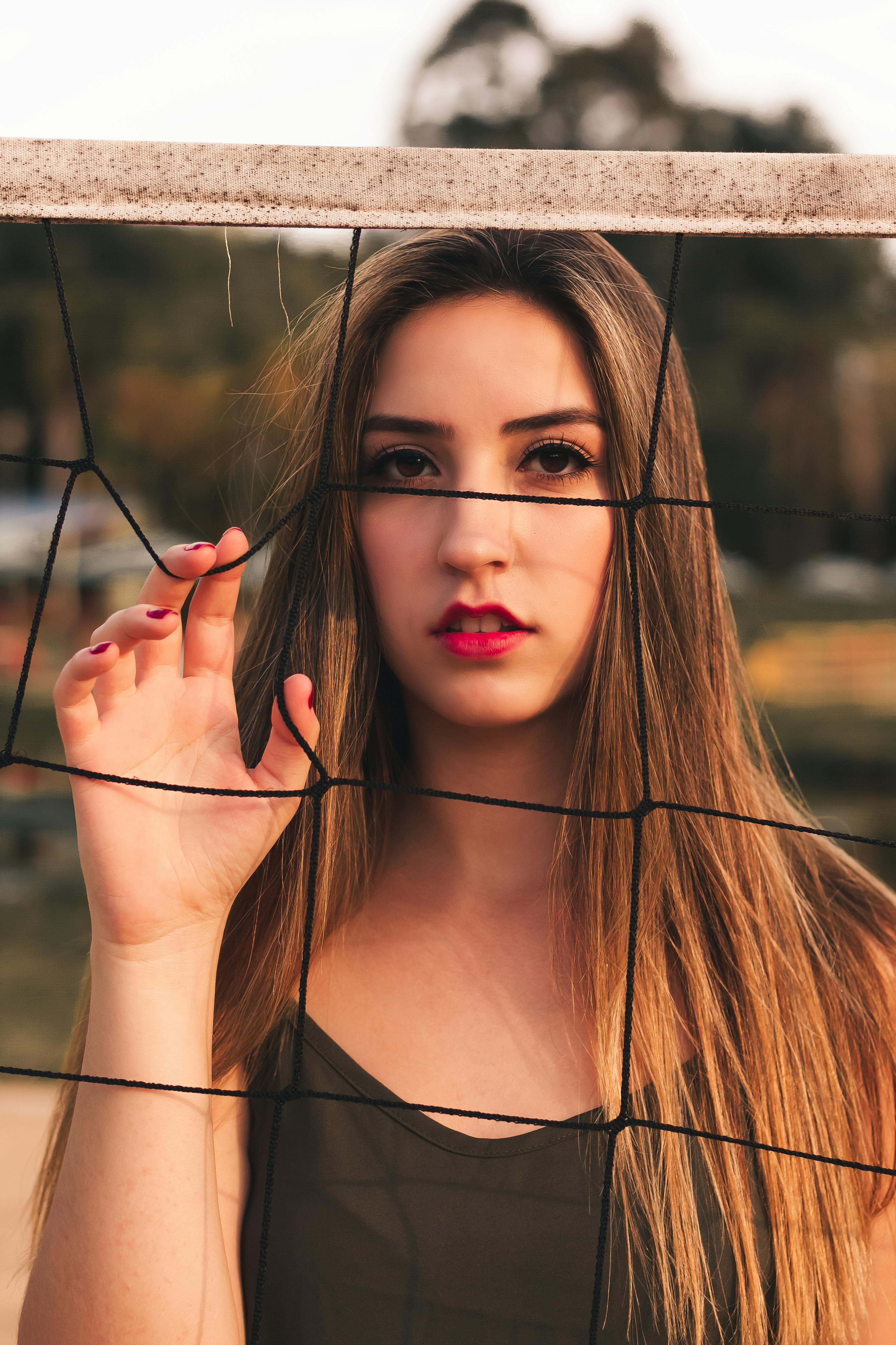 Woman Holding Volleyball Net · Free Stock Photo