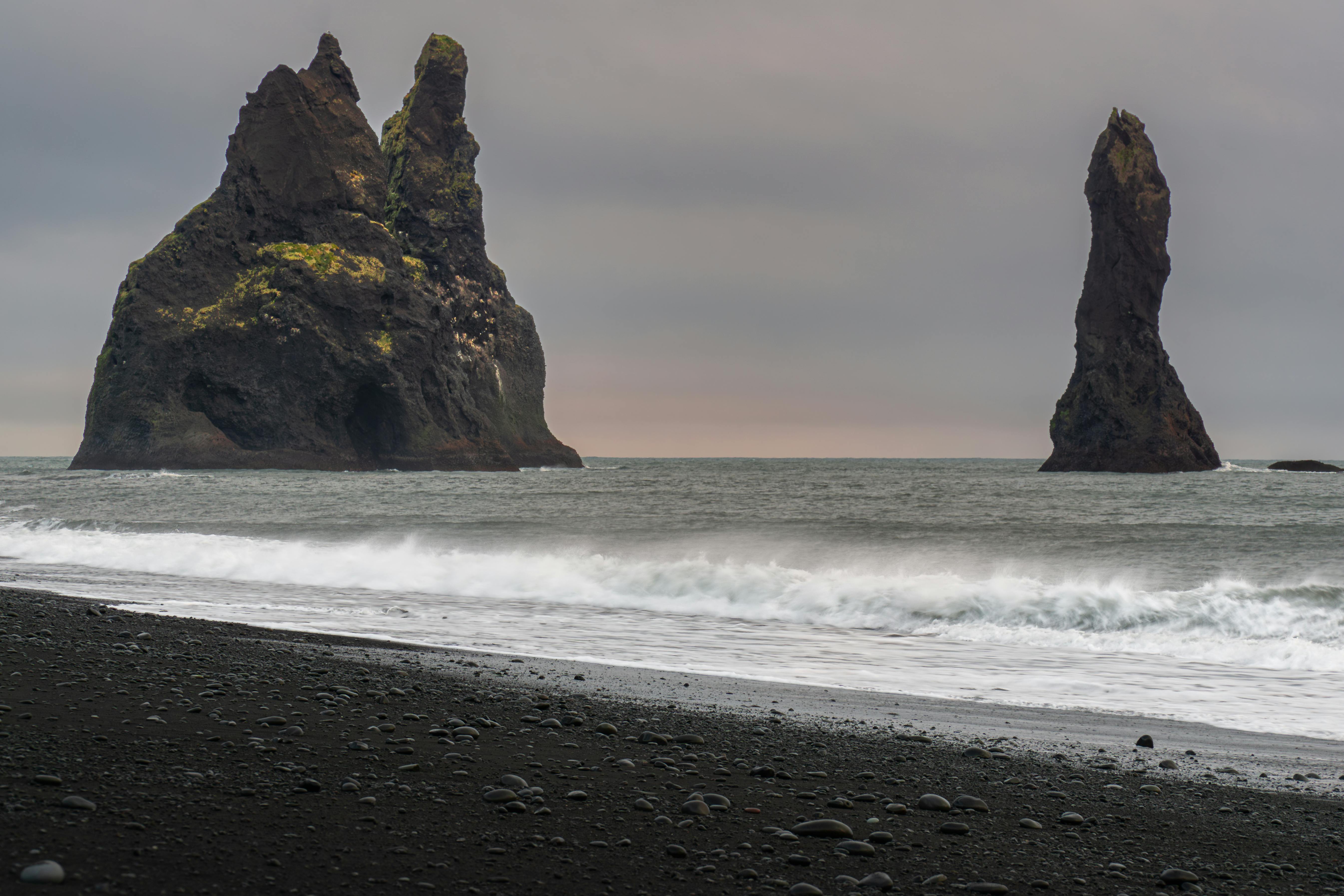Two Rock Formations by a Black Beach in Iceland · Free Stock Photo