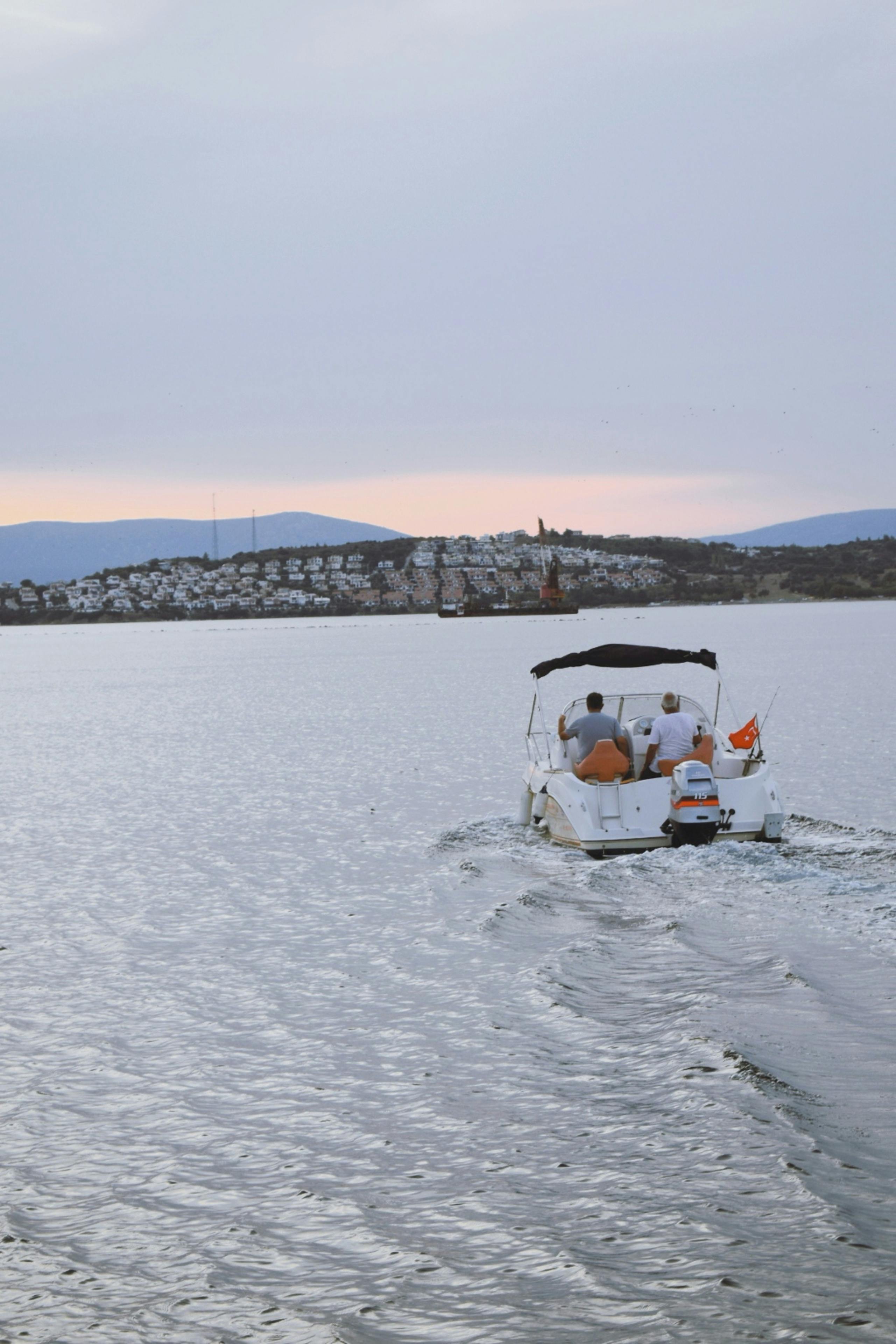 A Man Riding on a Motorboat · Free Stock Photo