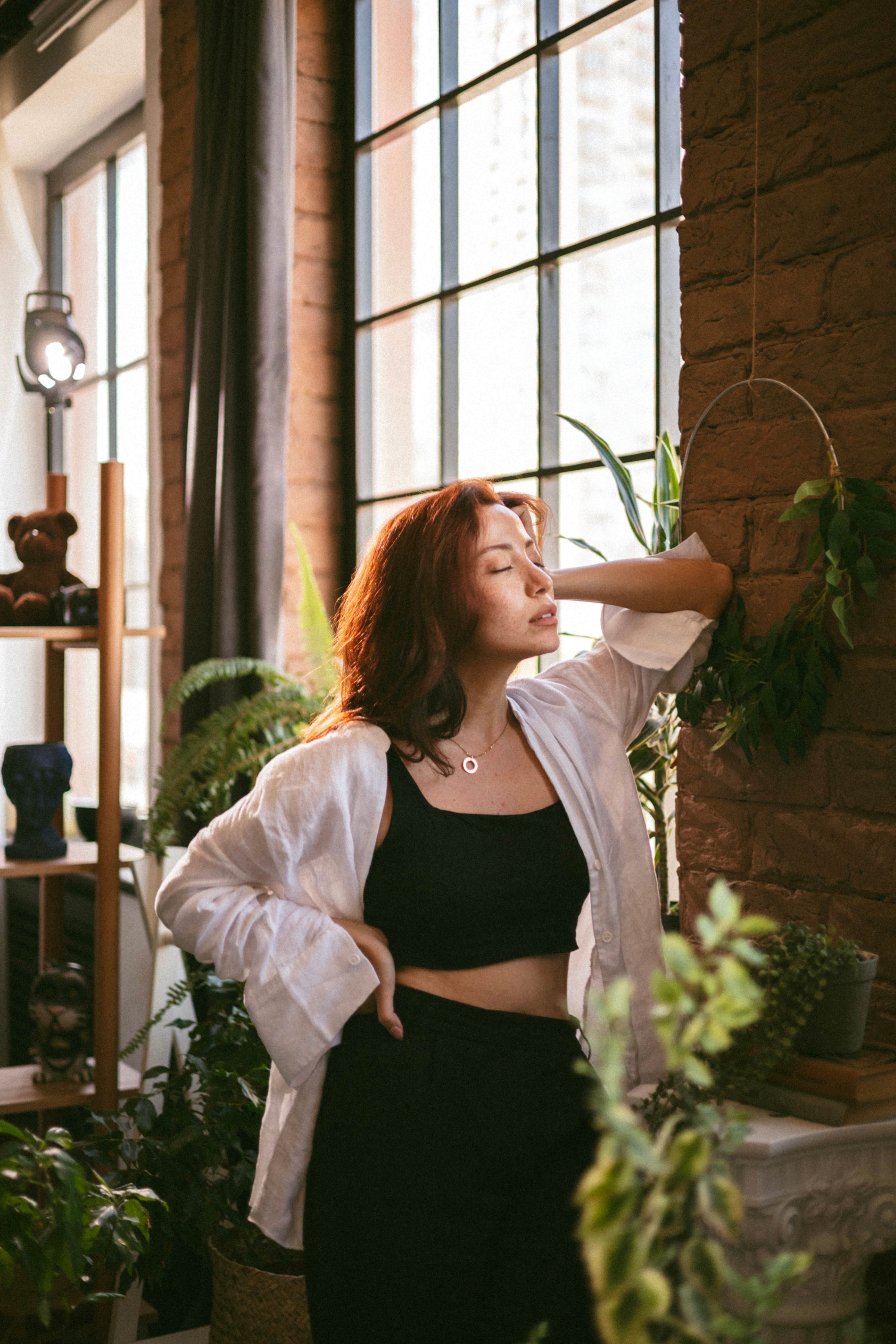Woman with an Unbuttoned Blouse Standing in the Lake · Free Stock Photo