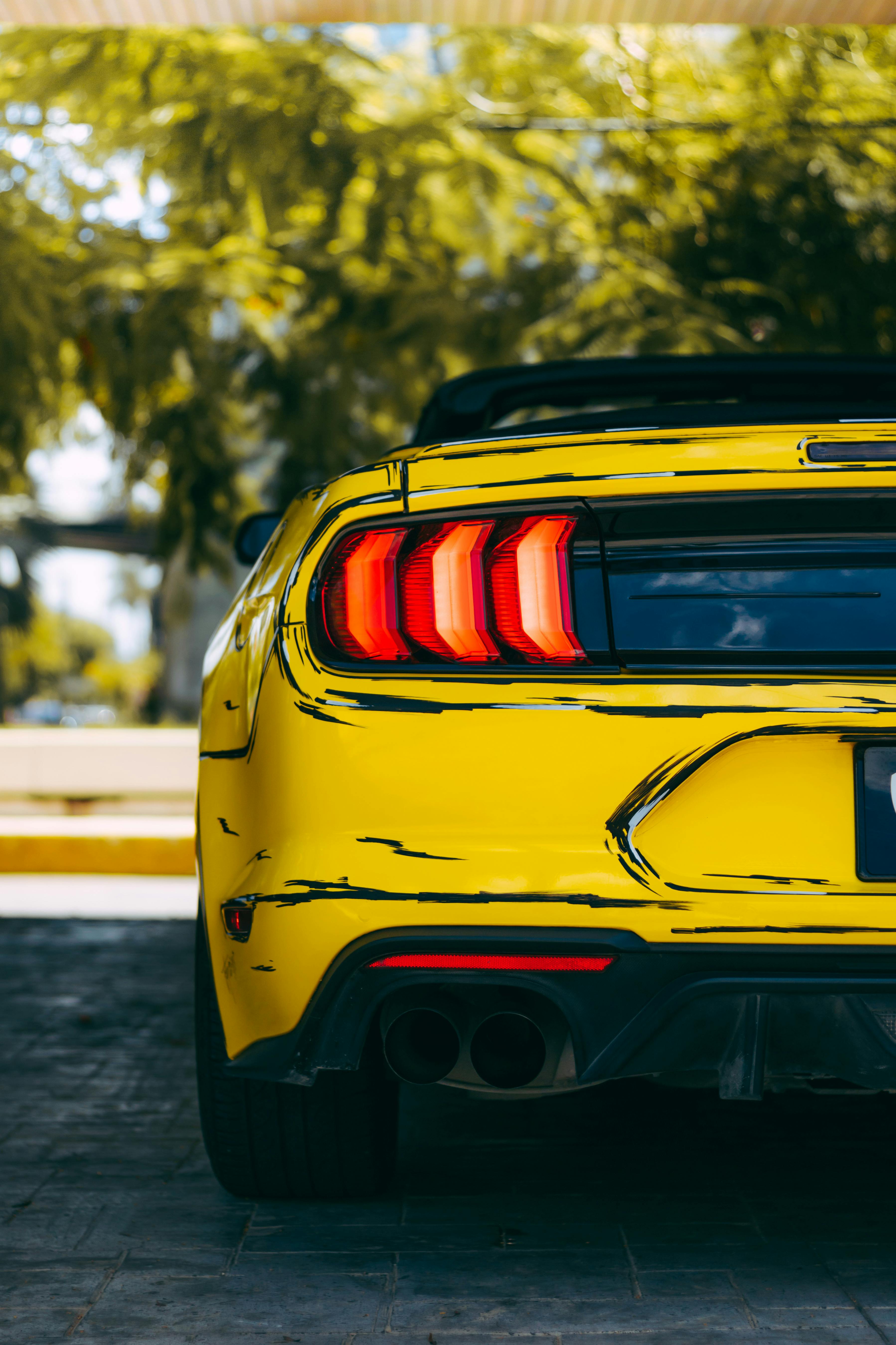 Back of a Yellow Ford Mustang · Free Stock Photo