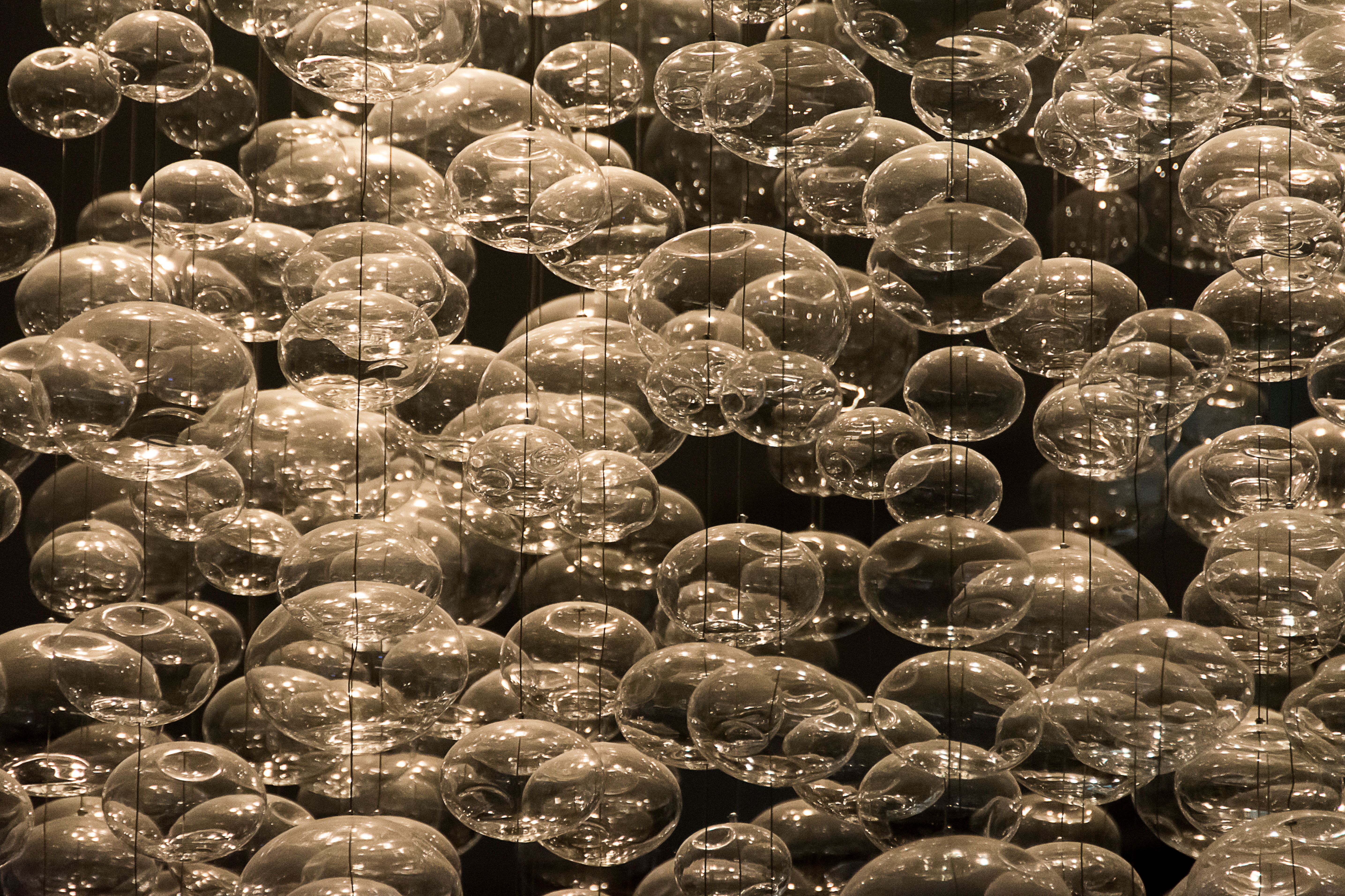 Large Variety of Glass Spheres Hanging on Strings · Free Stock Photo