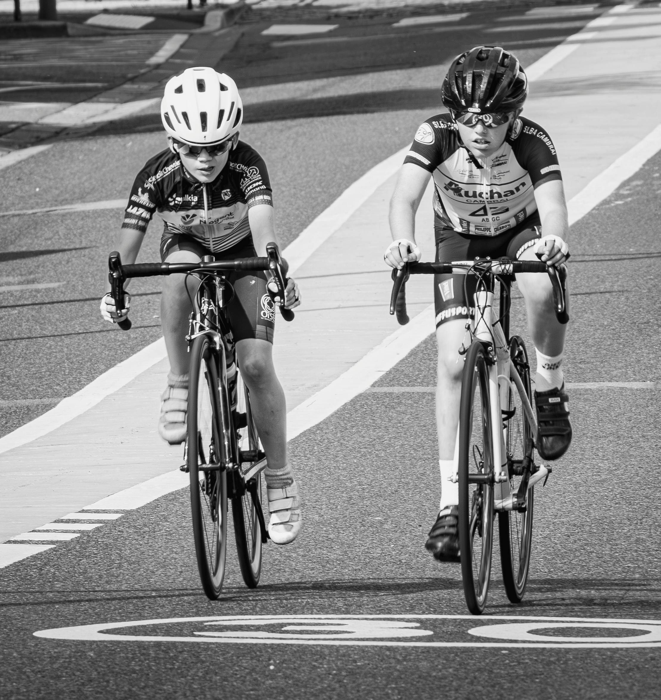 Two Cyclists Racing Side by Side · Free Stock Photo