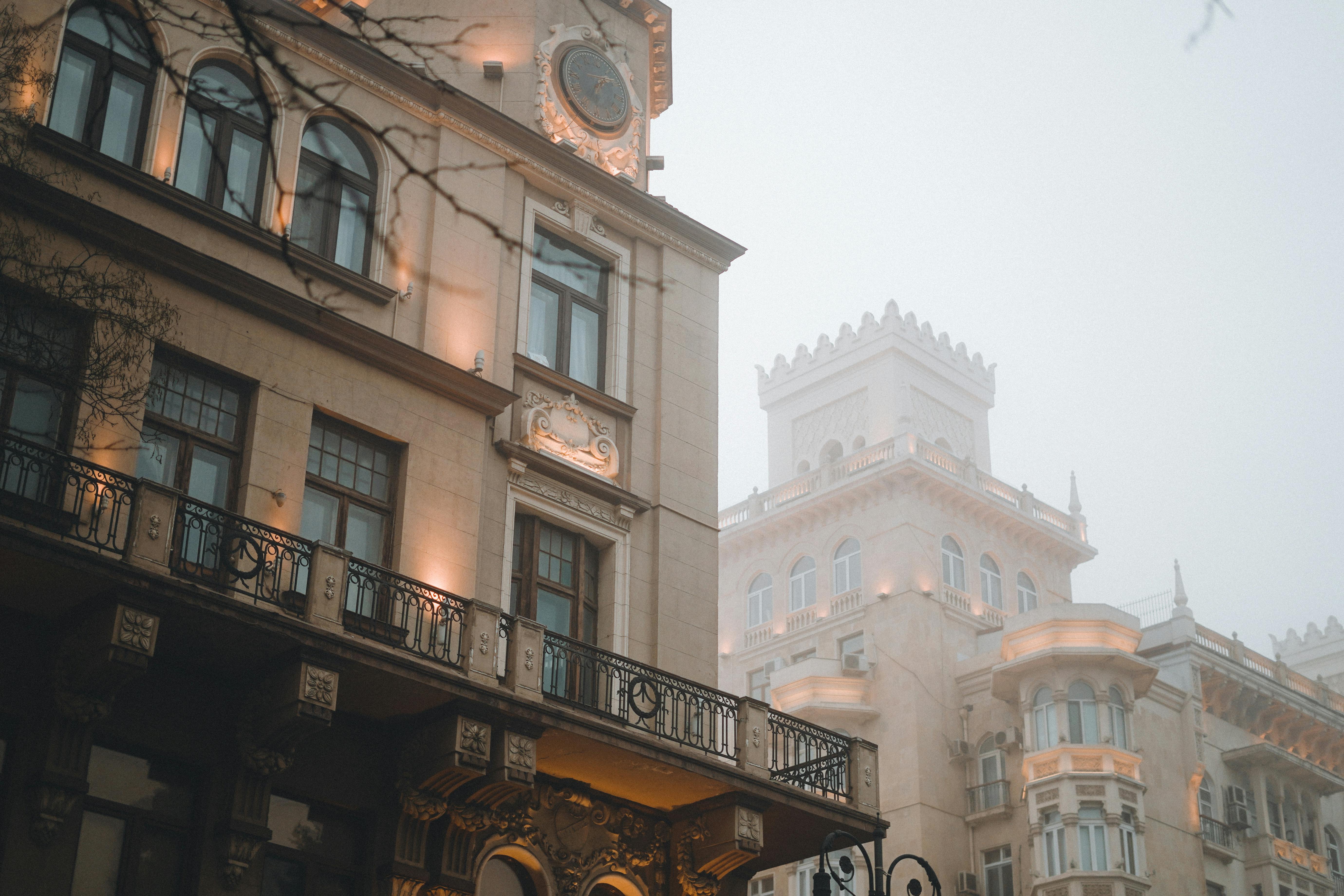 City Buildings in Fog with a Balcony in the Foreground · Free Stock Photo