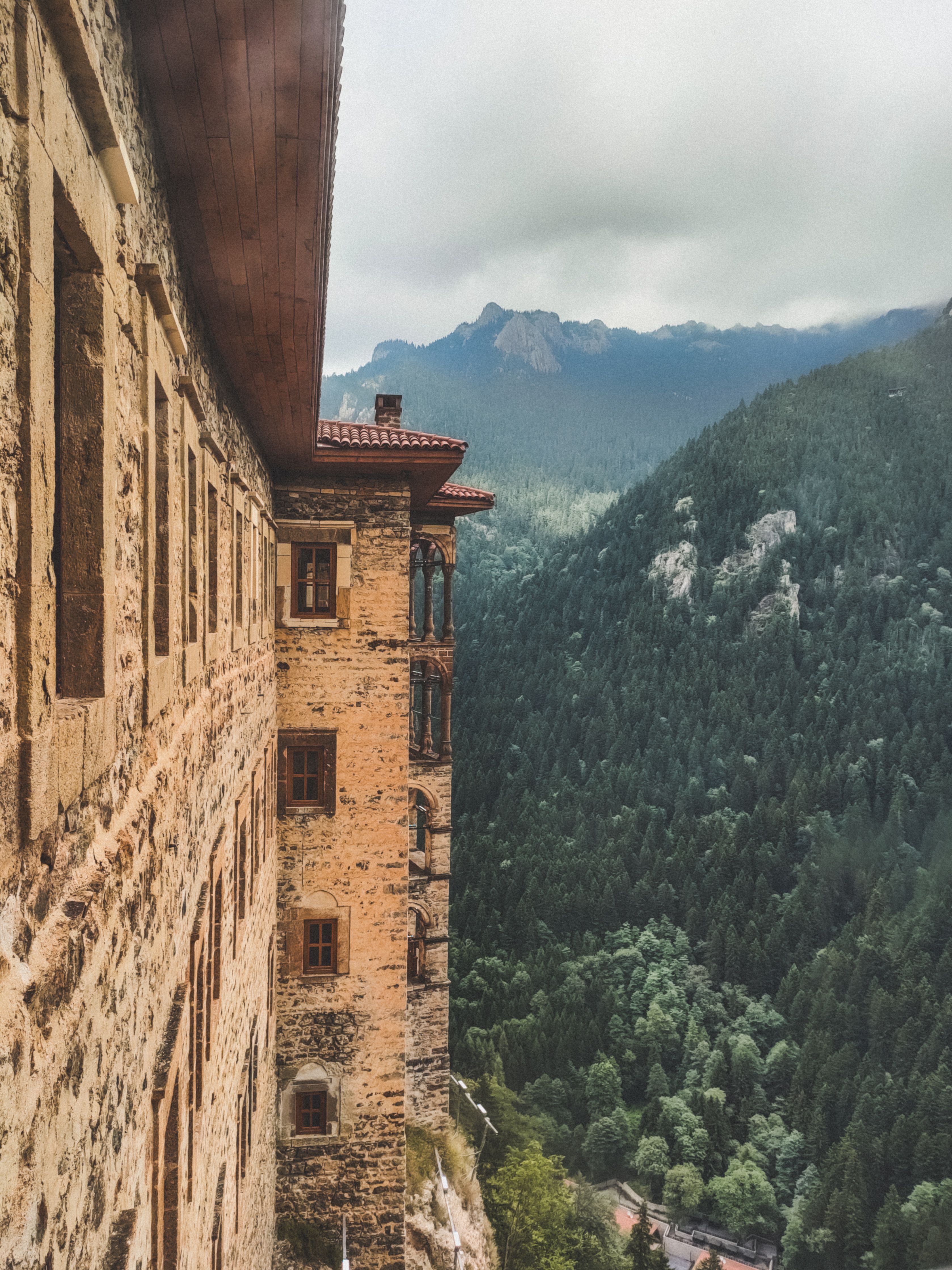 Stone Building Wall over Forest in Valley in Mountains · Free Stock Photo