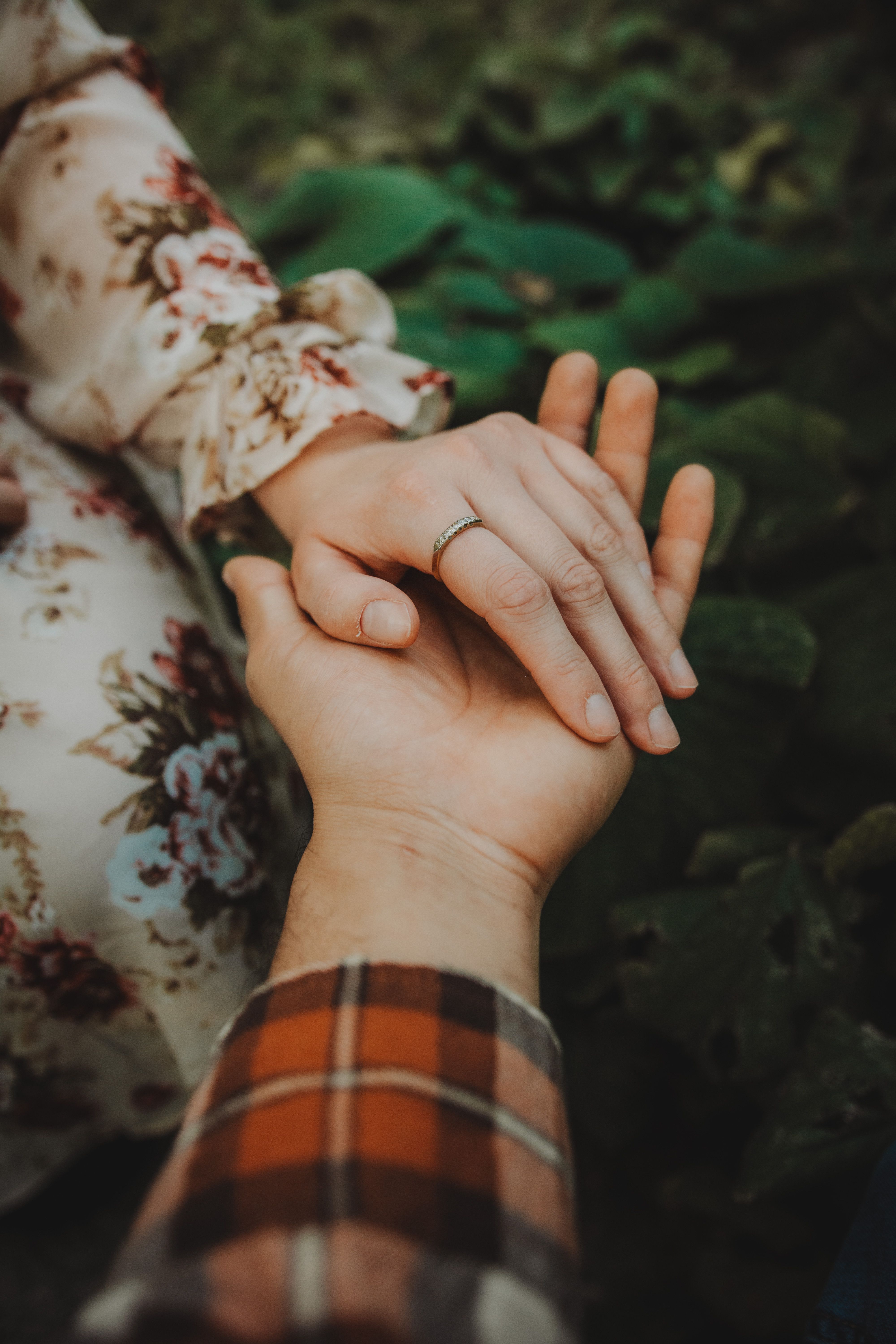 Close-up of a Couple Holding Hands · Free Stock Photo