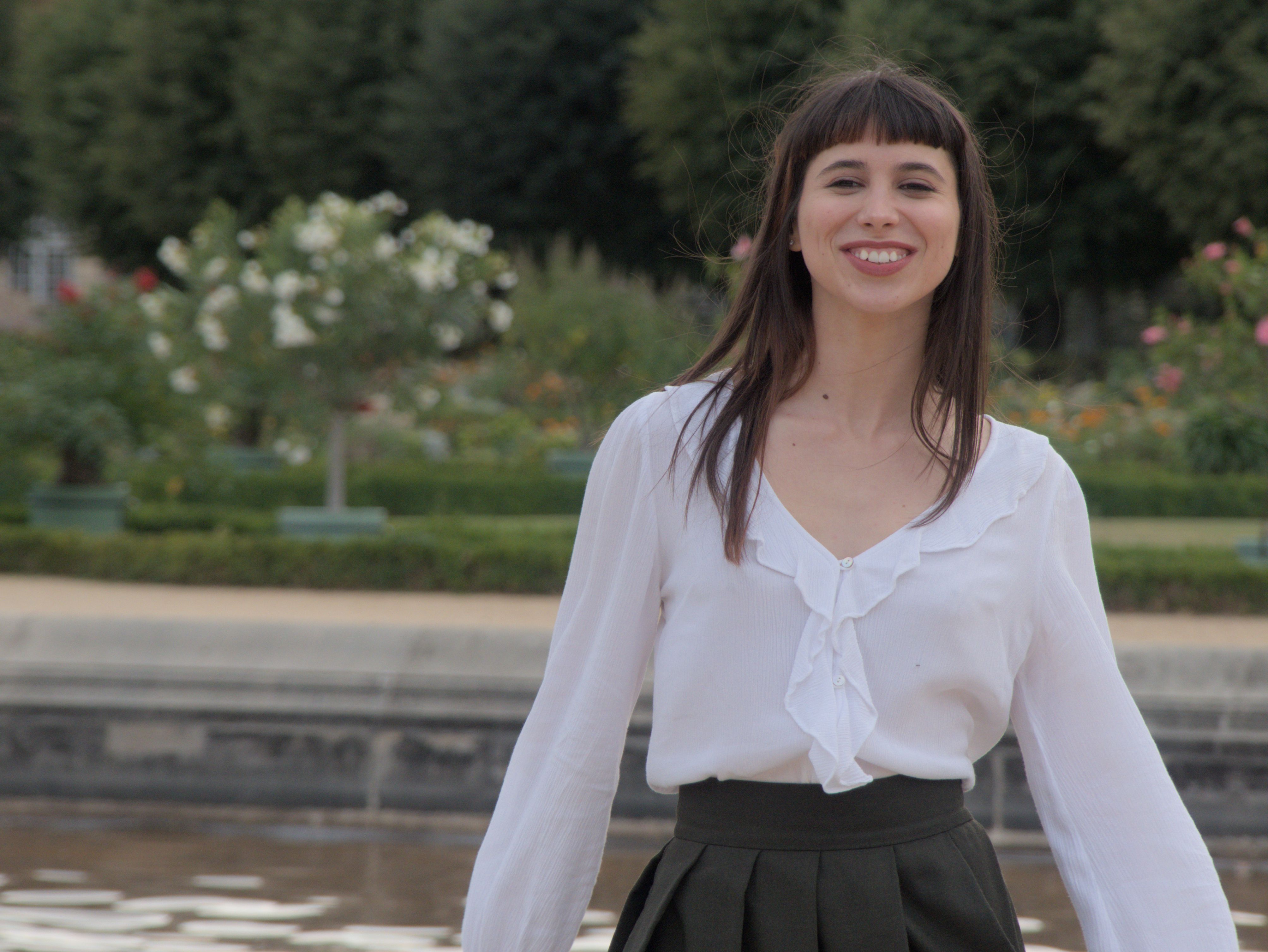 Young Elegant Woman Standing in the Park · Free Stock Photo