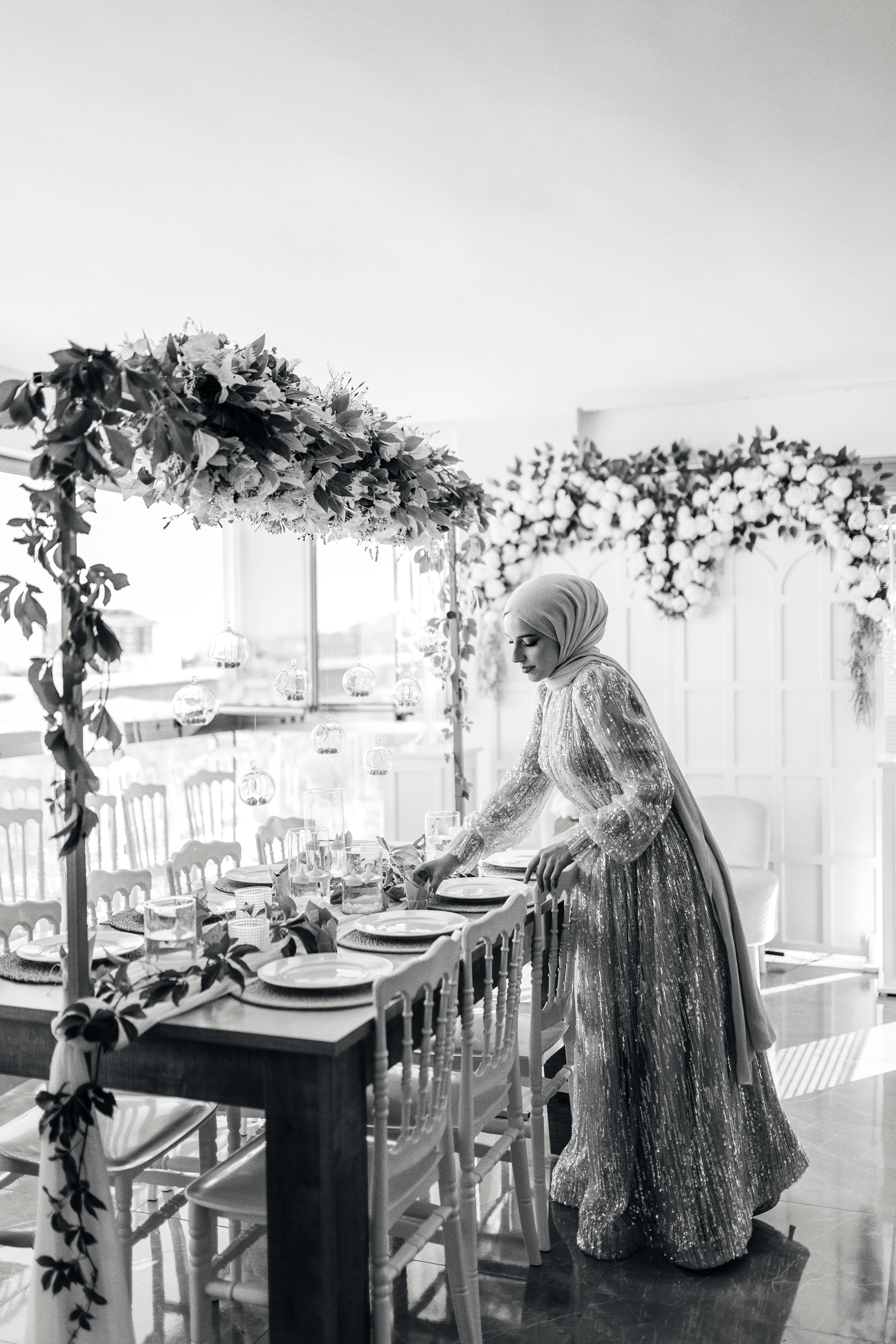 Bride in Wedding Dress and Headscarf Setting the Table for Wedding ...