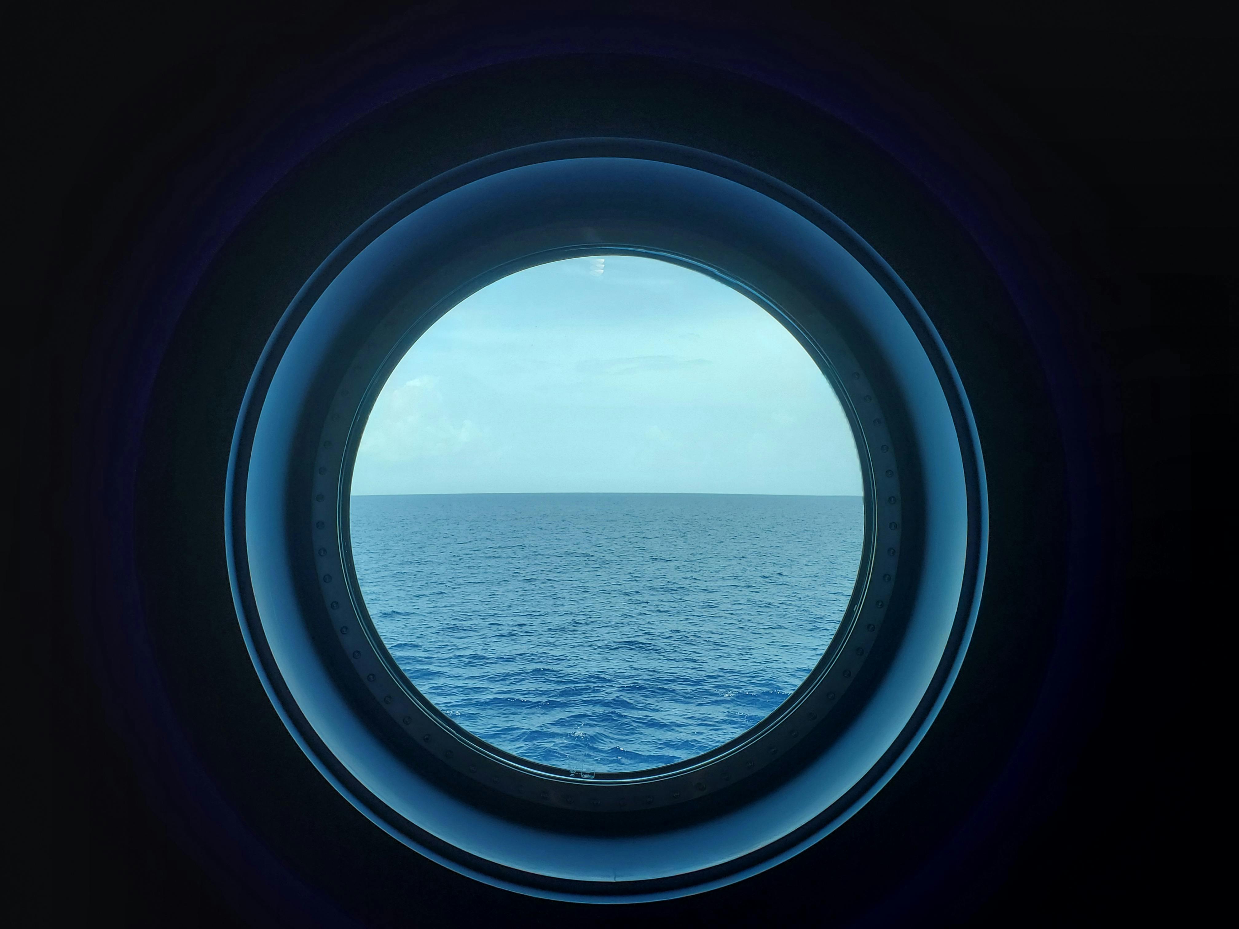 Sea Water behind Circular Window · Free Stock Photo