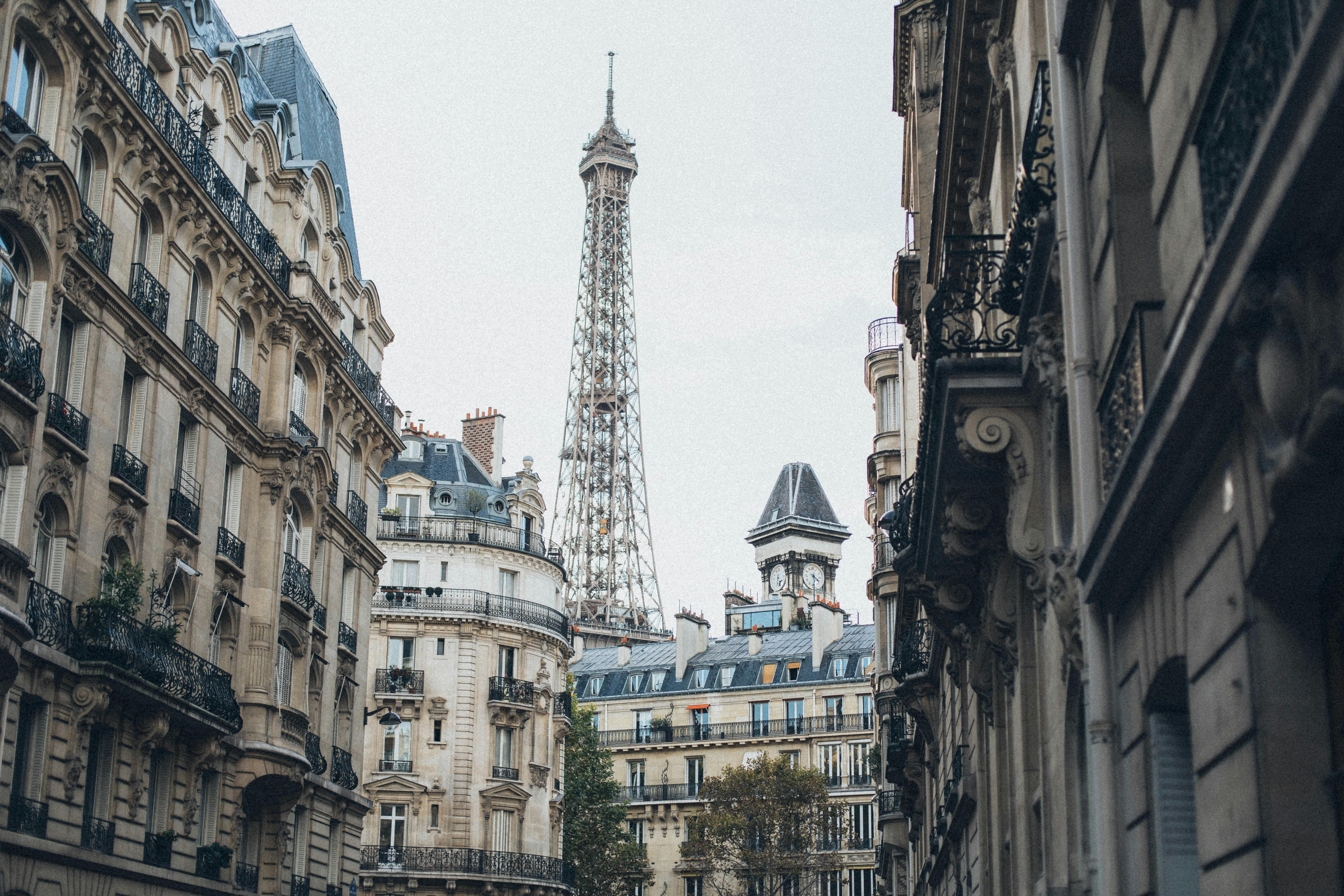 Eiffel Tower Behind Buildings · Free Stock Photo