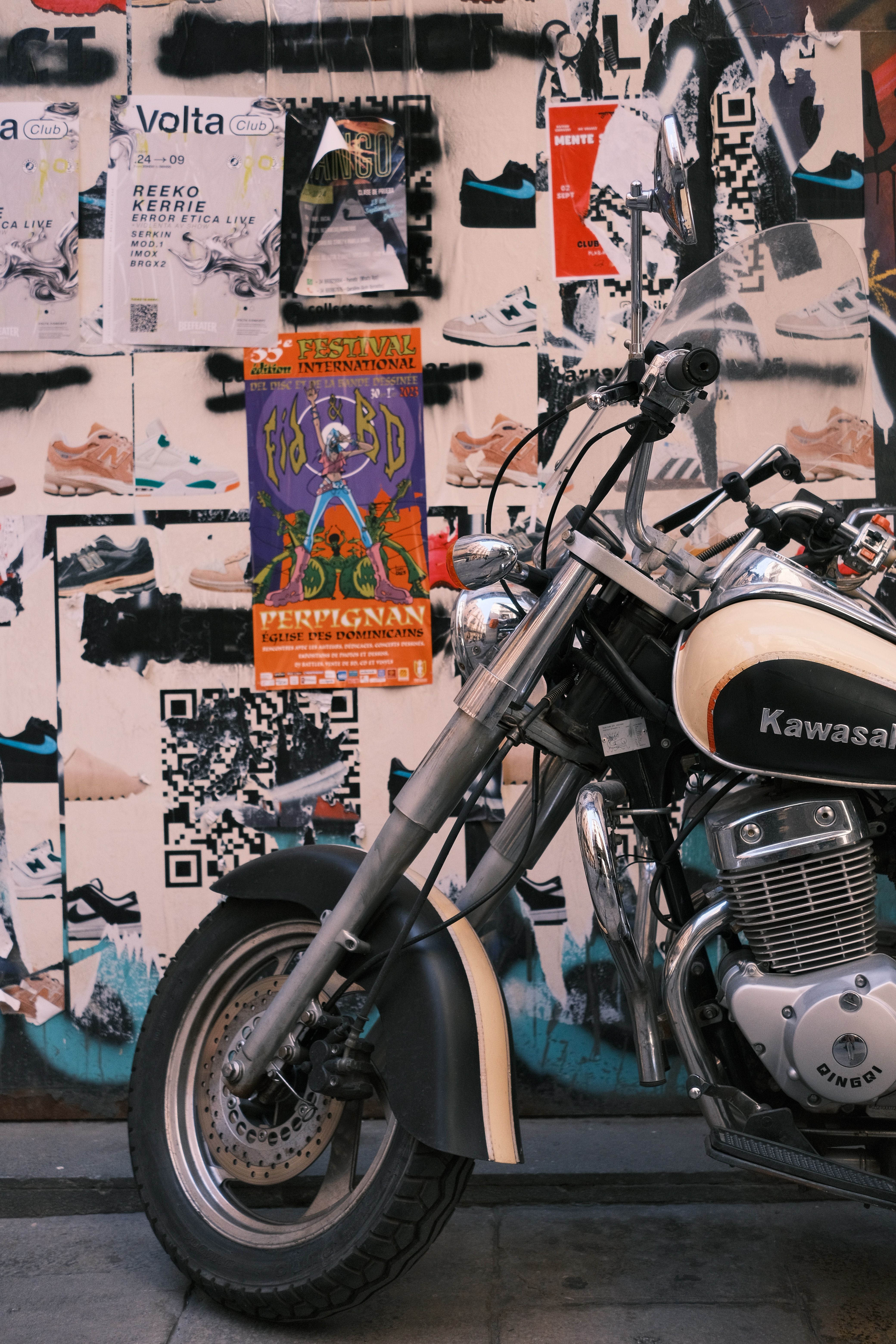 Kawasaki Motorbike near Wall · Free Stock Photo