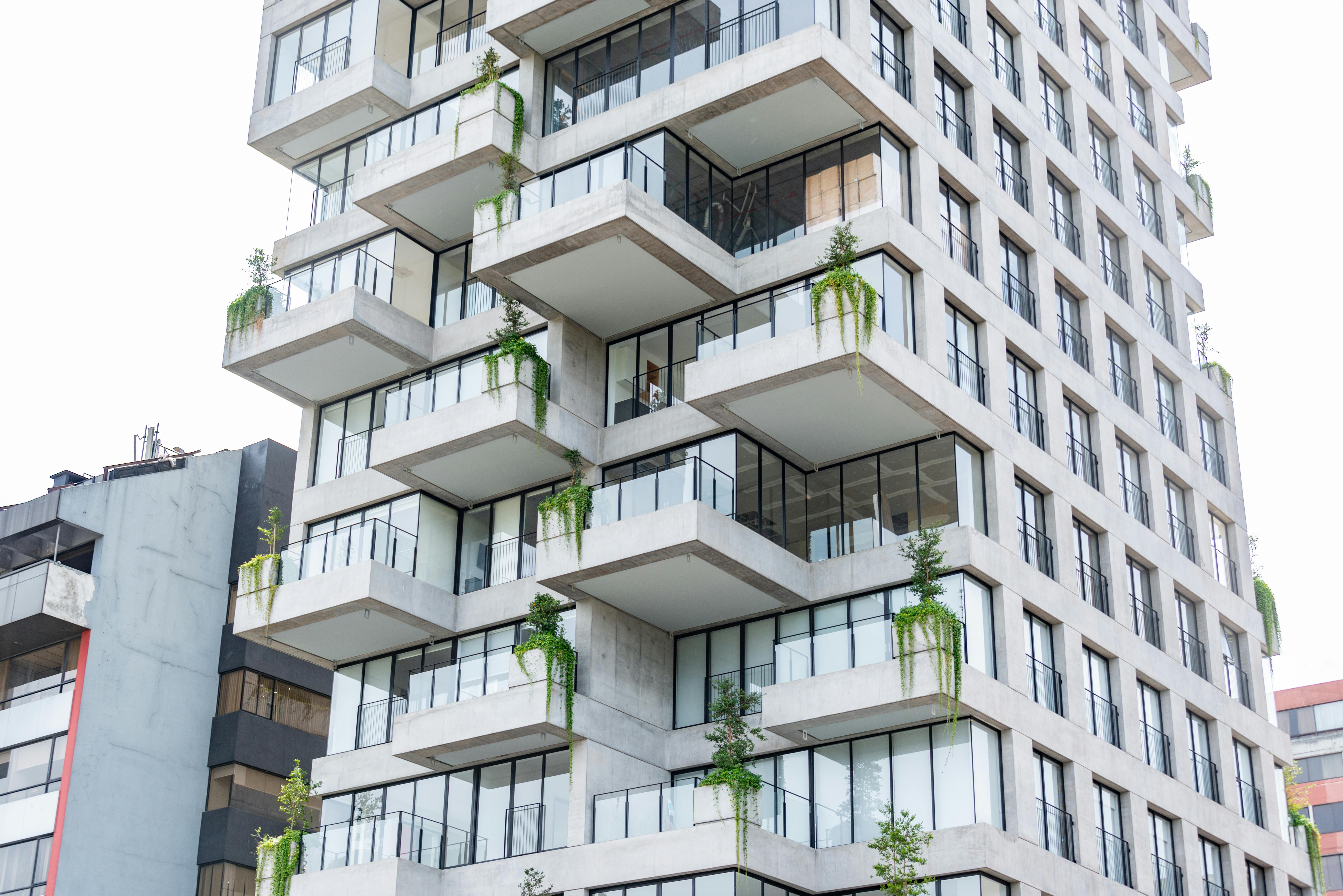 Potted Plants Growing on Balconies of Qorner Tower, Quito, Ecuador · Free Stock Photo