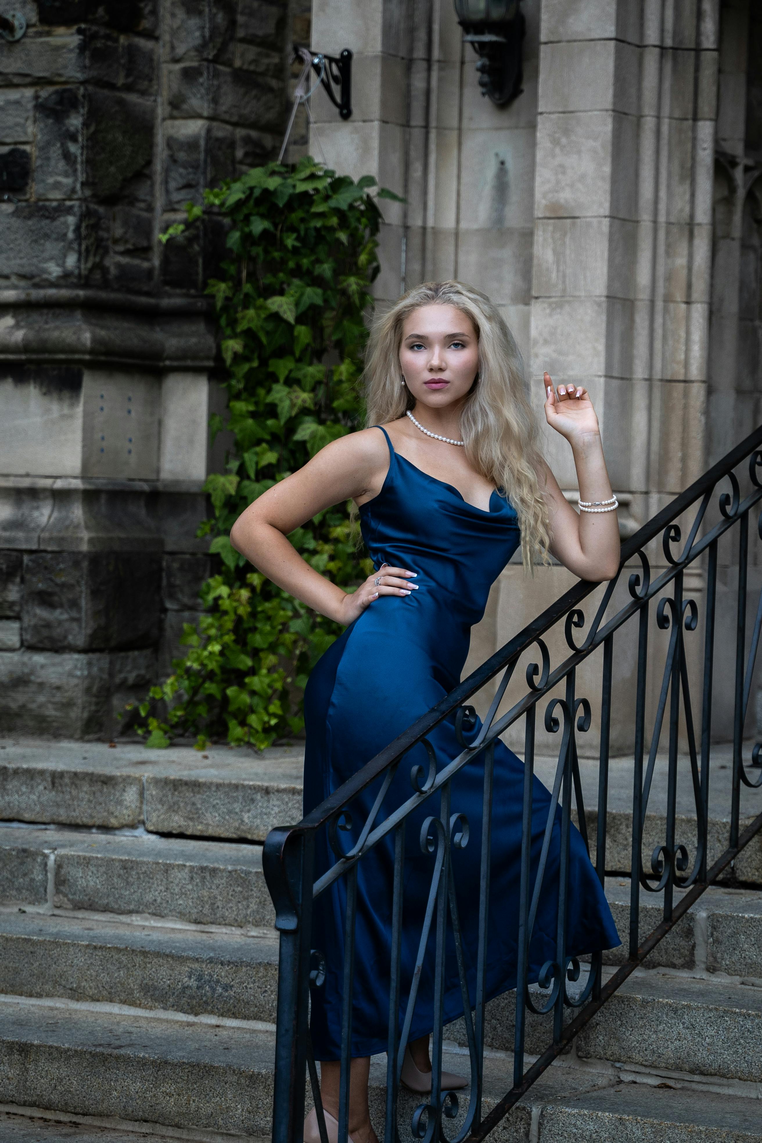 Woman Wearing Red Dress Posing on Stairs · Free Stock Photo