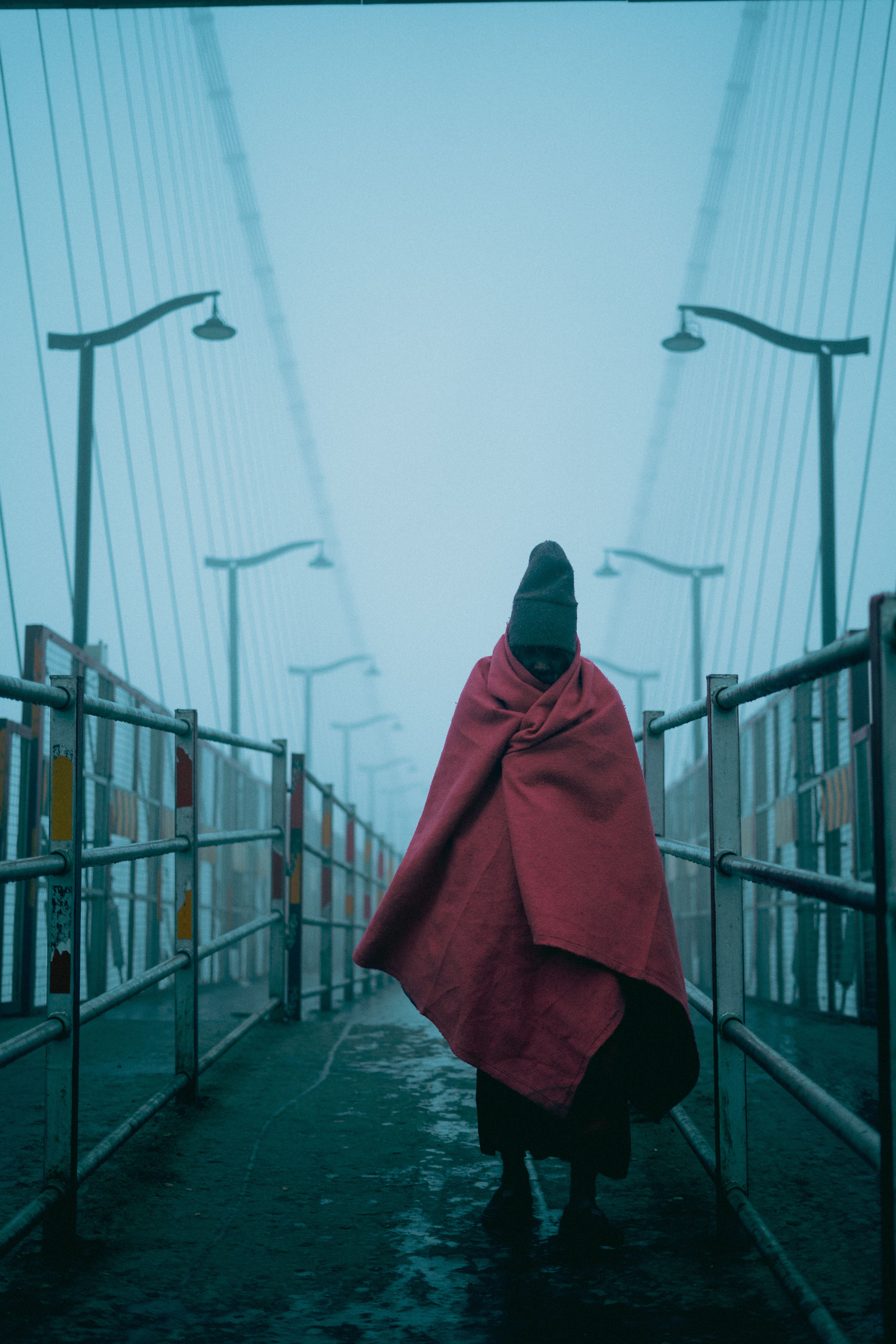 Woman Covered with Blanket on Cold Gloomy Day · Free Stock Photo
