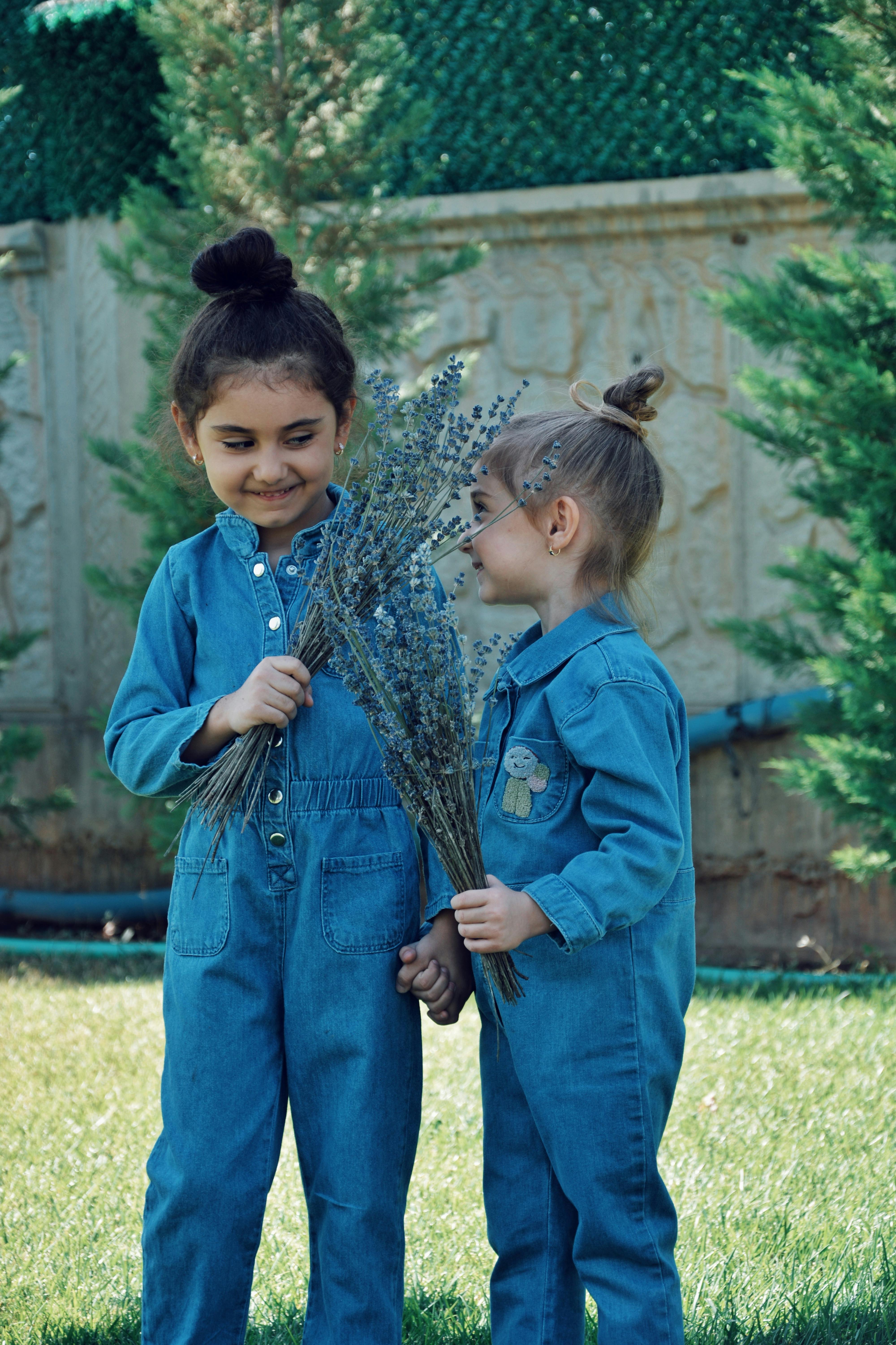 Children Dressed in Denim Overalls Holding Handfuls of Lavender Flowers ...